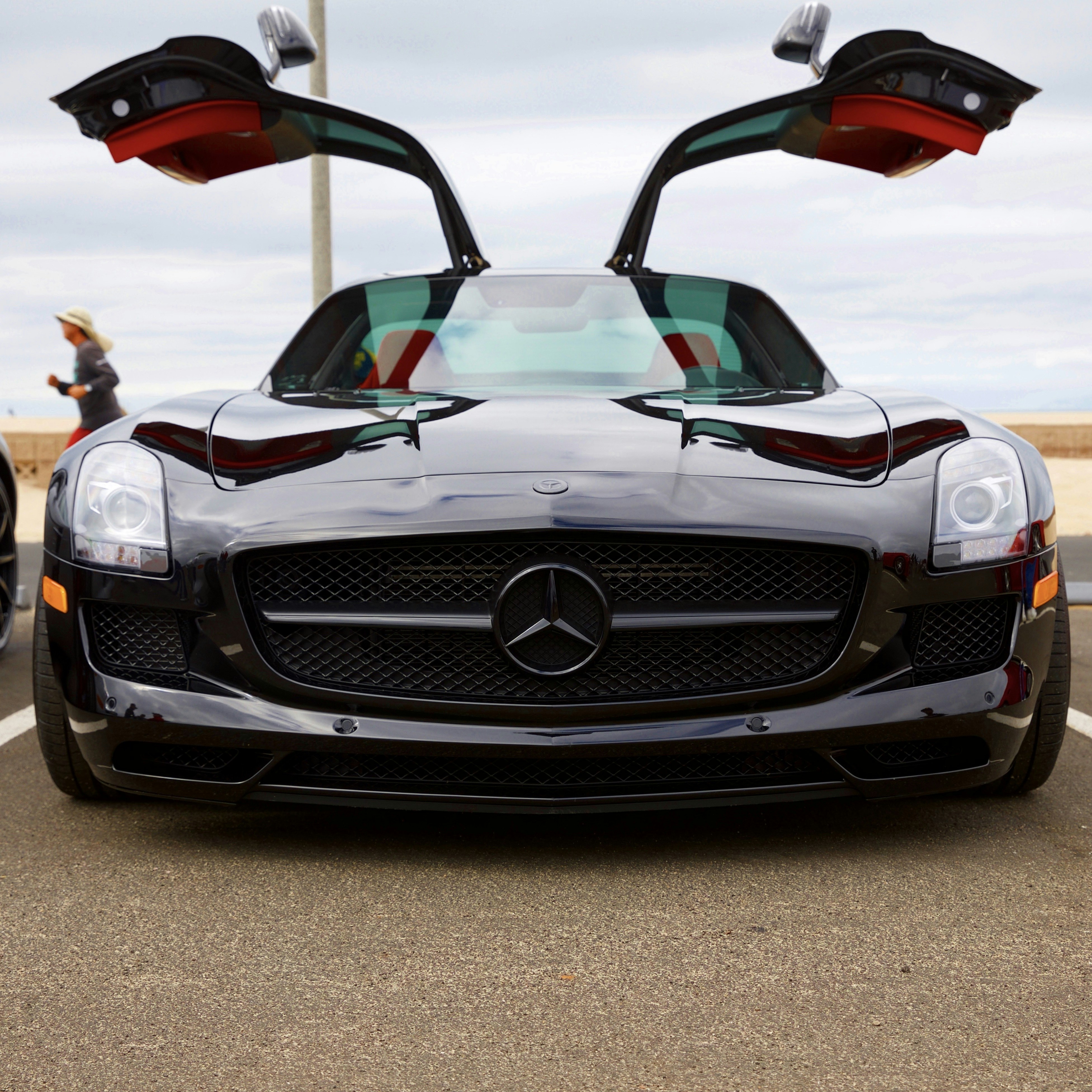 Gullwing Majesty: Front View of a Glossy Mercedes-Benz SLS AMG
