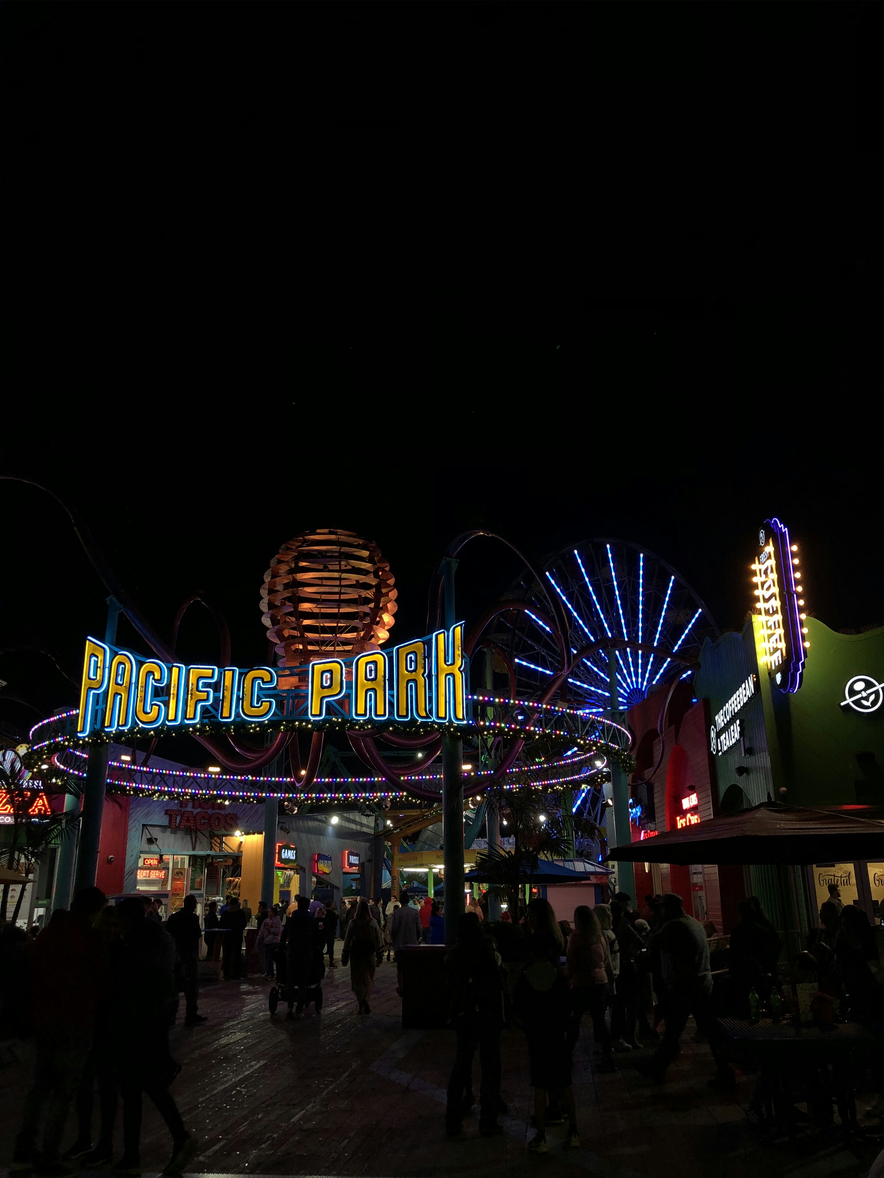 people walking on street during nighttime