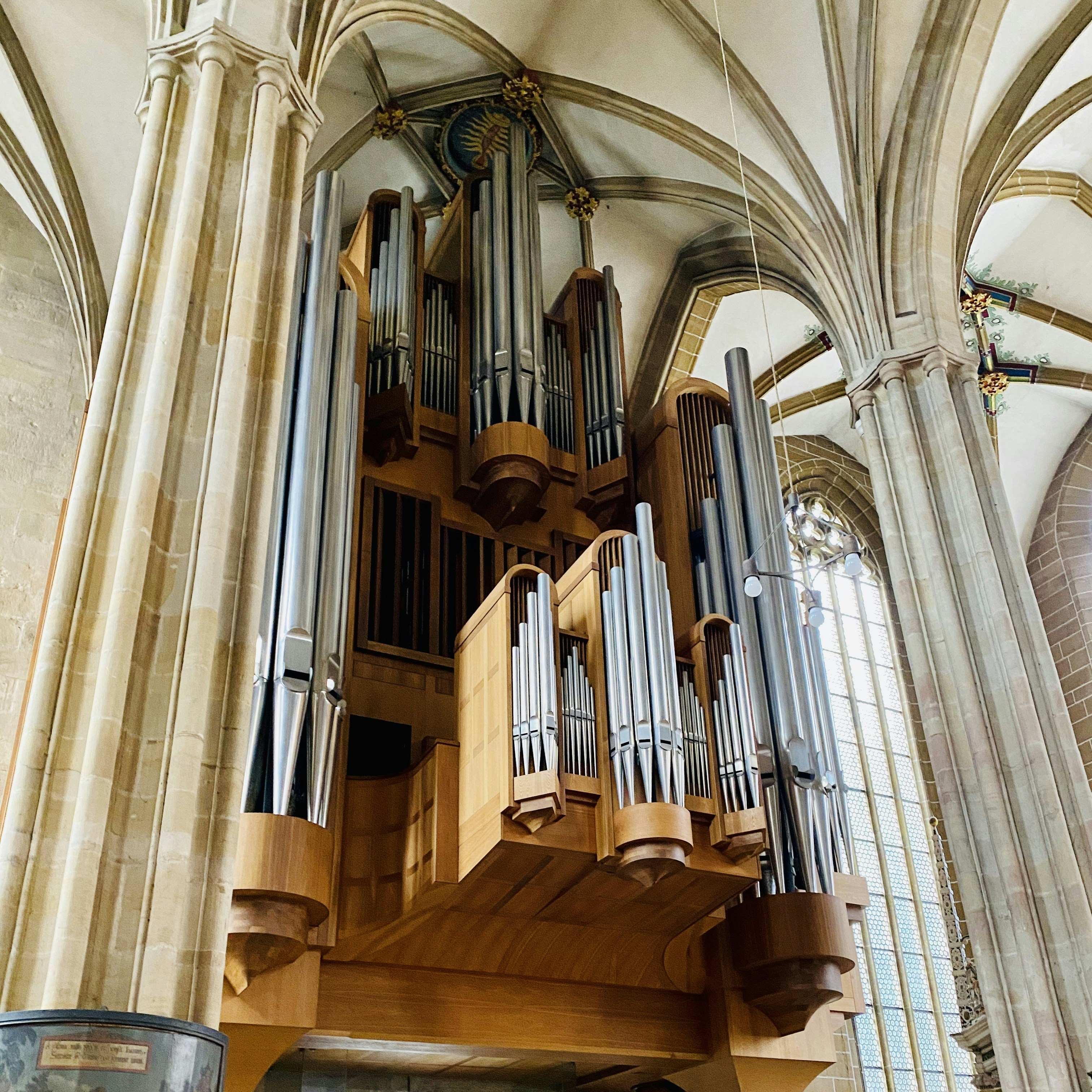 Massive organ pipes soaring within the gothic arches of Erfurt Cathedral.