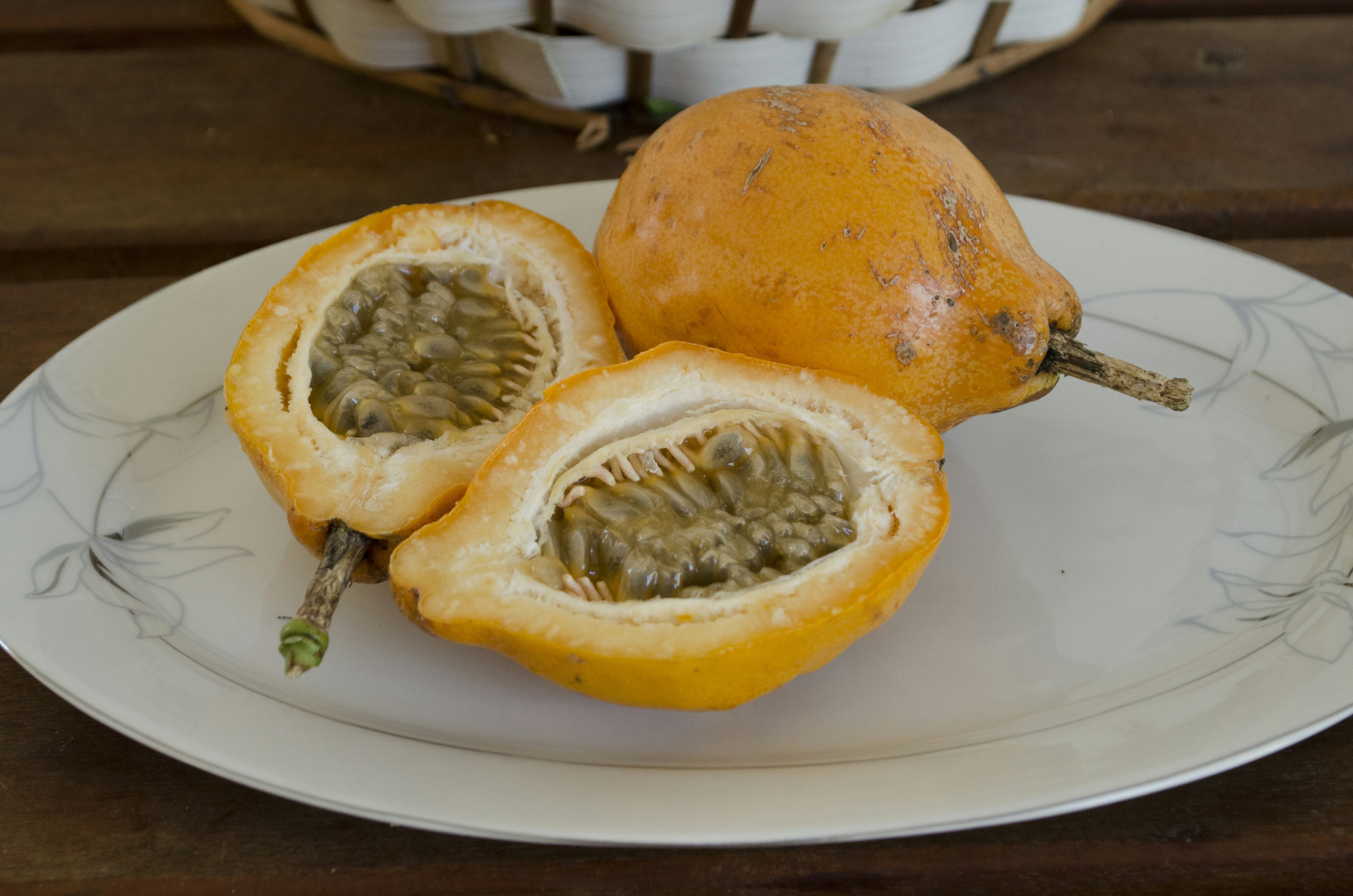 orange fruit on white ceramic plate