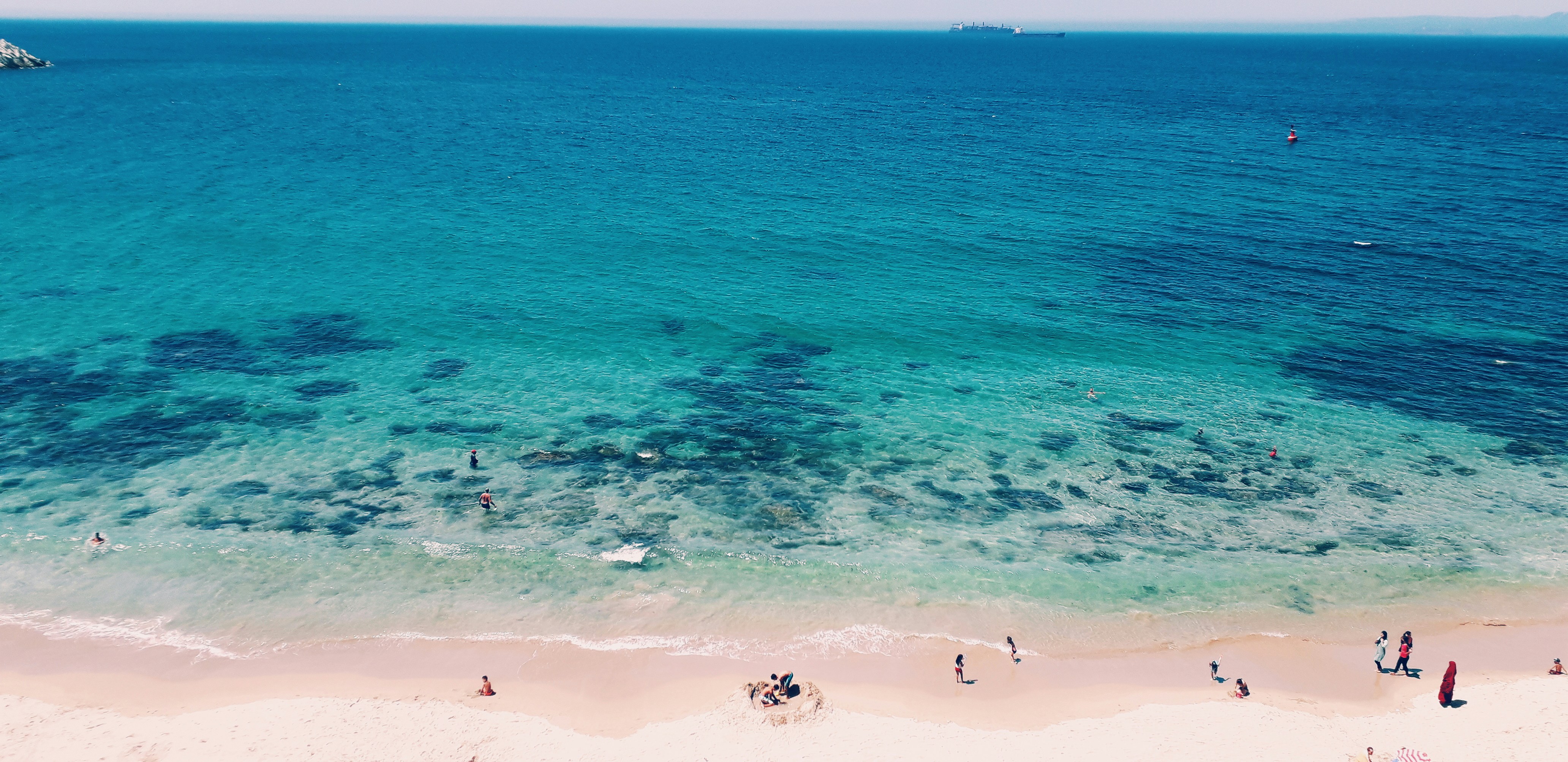 People on beach during daytime photo – Free Tanger Image on Unsplash