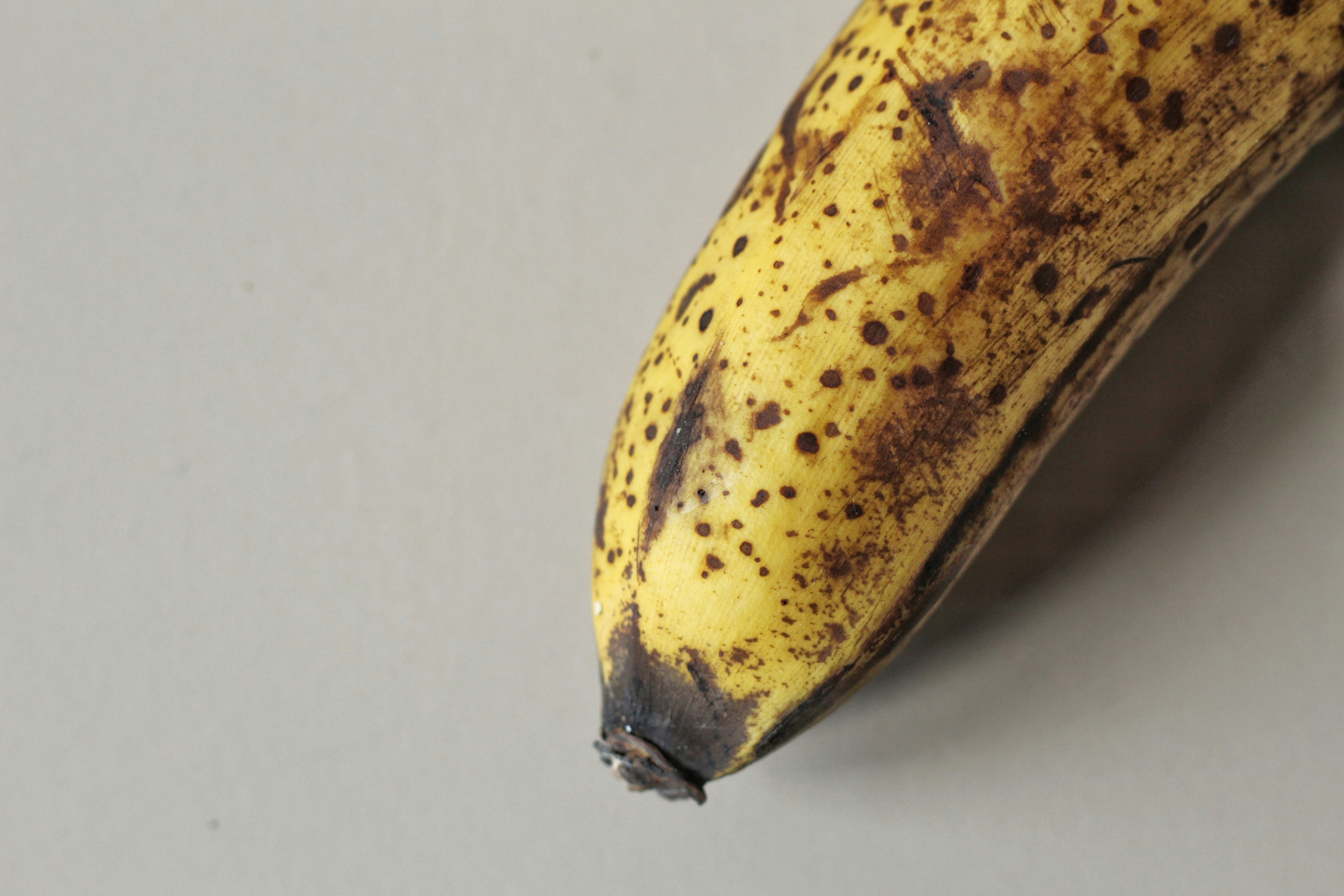 yellow banana fruit on white table