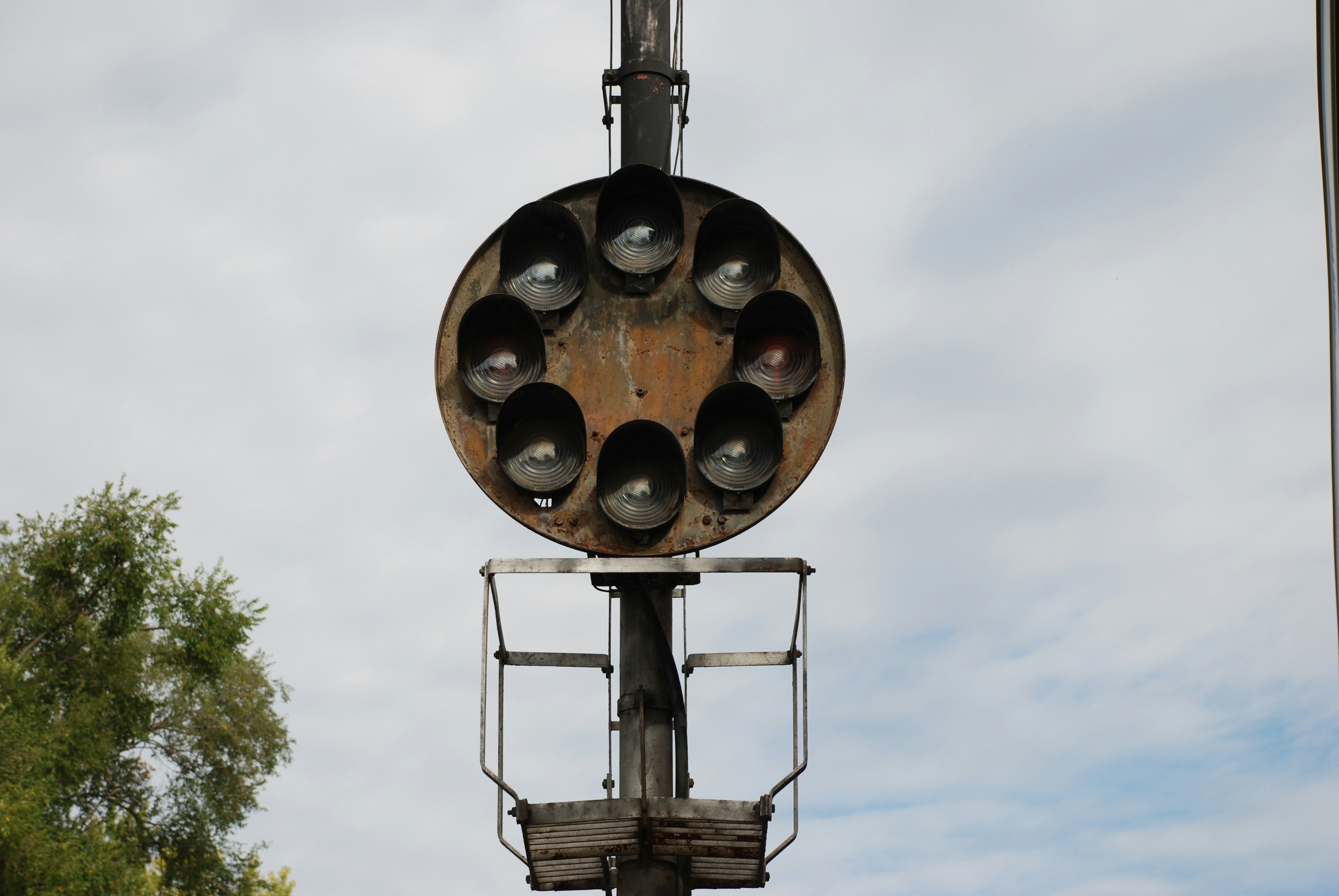 Industrial Sentinel: A Weathered Round Signal Tower