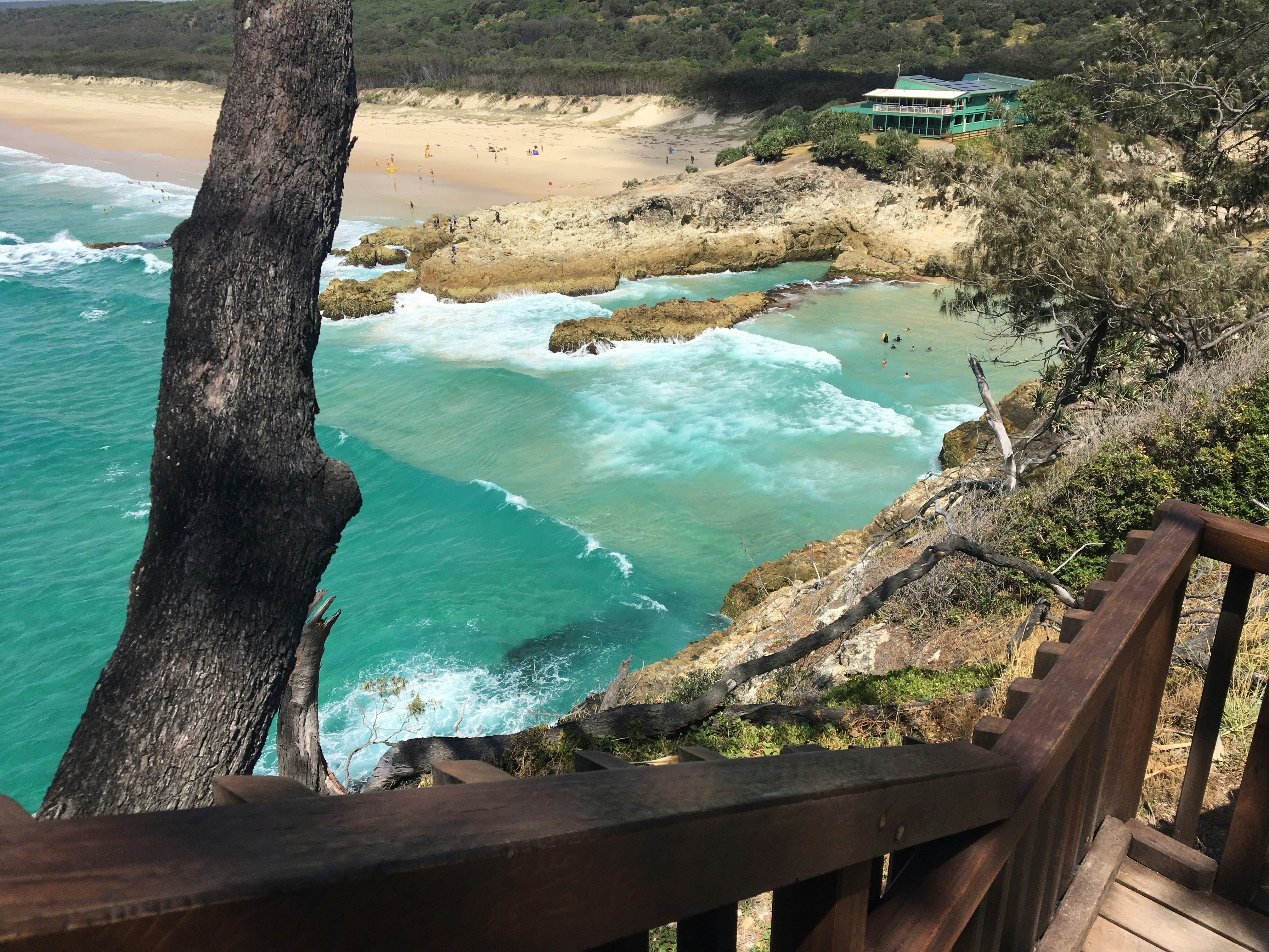 Teal Cove Ridge: A Cliffside View Toward Turquoise Waters