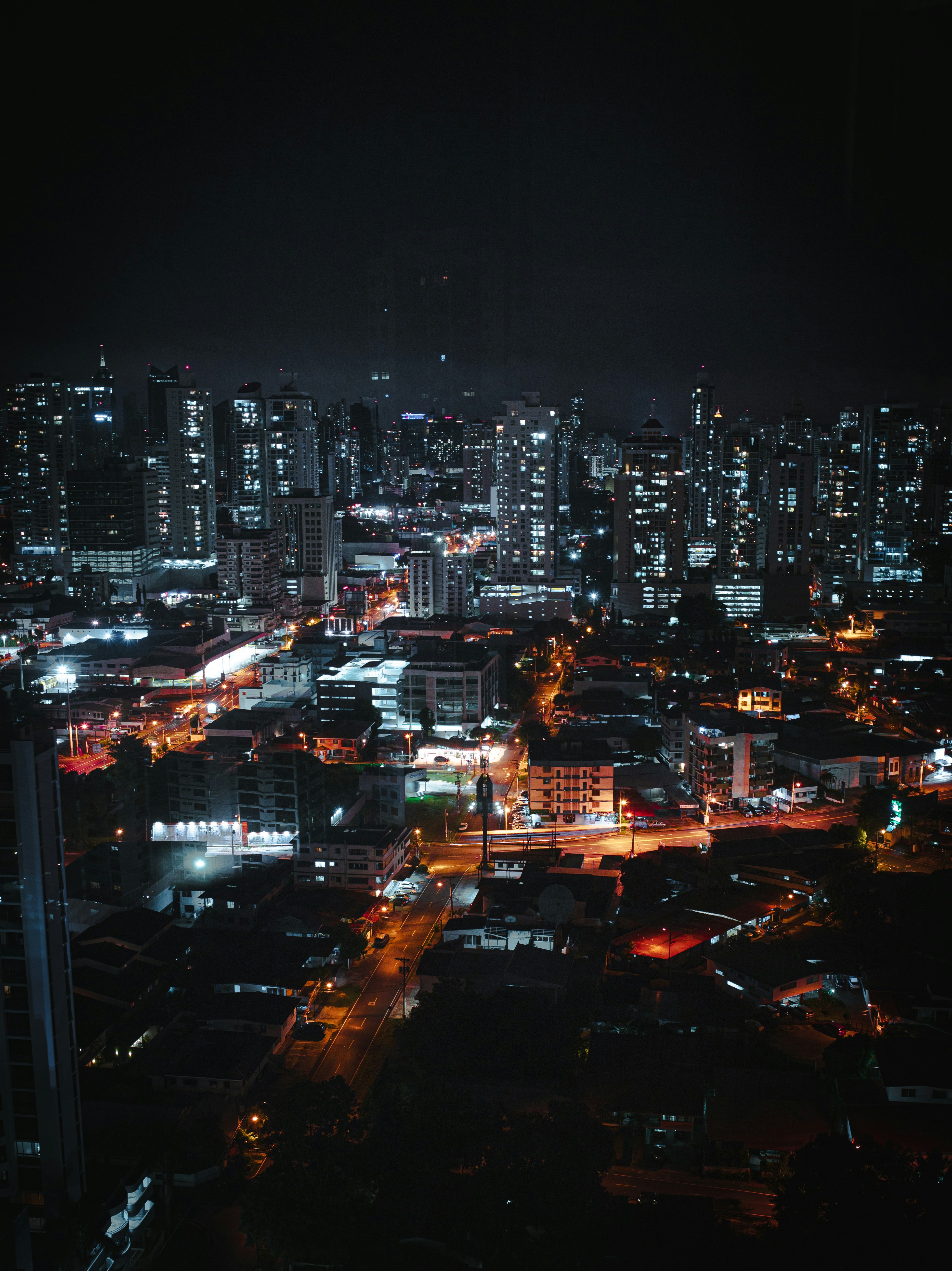 City with high rise buildings during night time photo – Free Grey Image ...