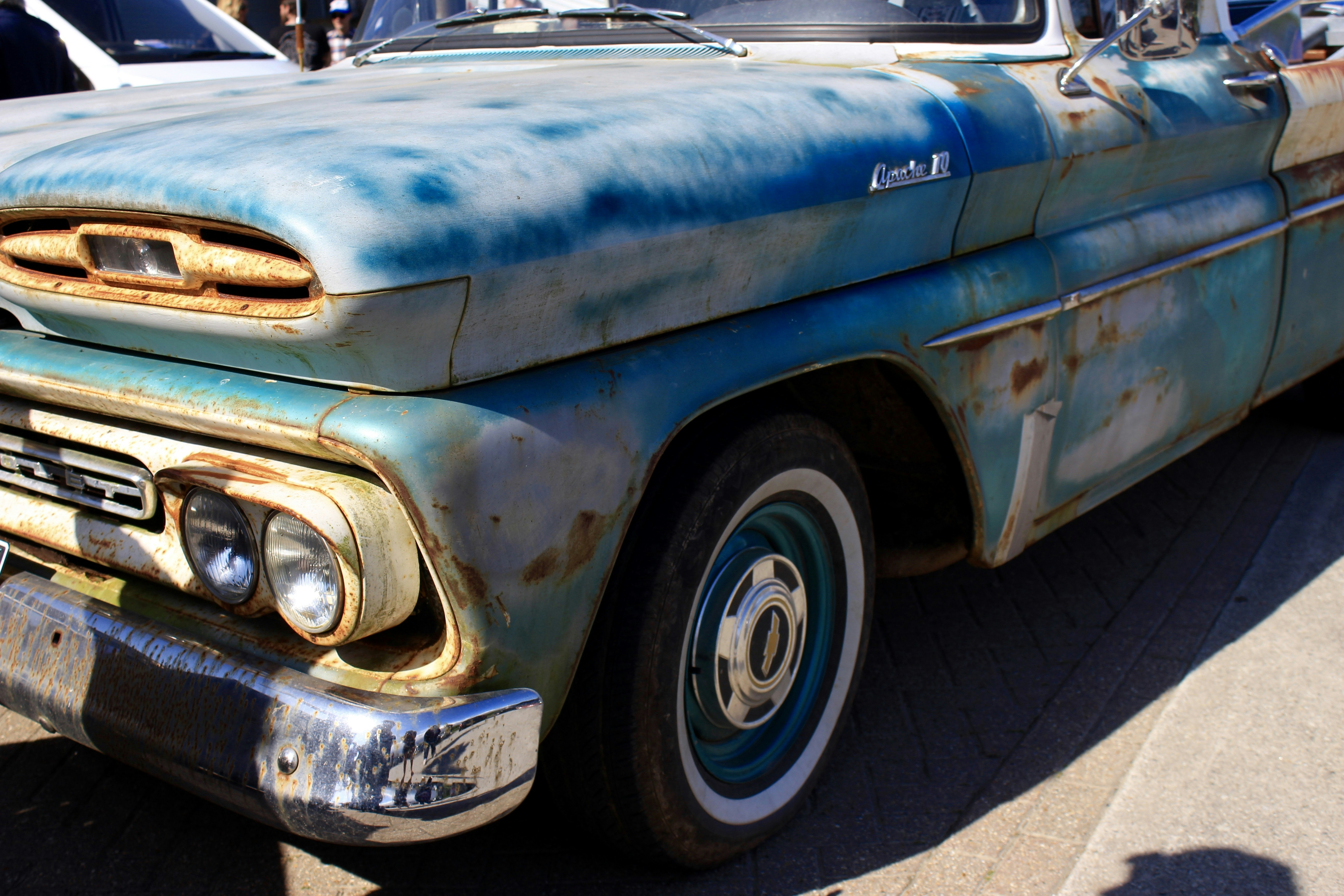 Close-up of a weathered vintage truck showcasing its patina and character, highlighting the beauty of age and history.
