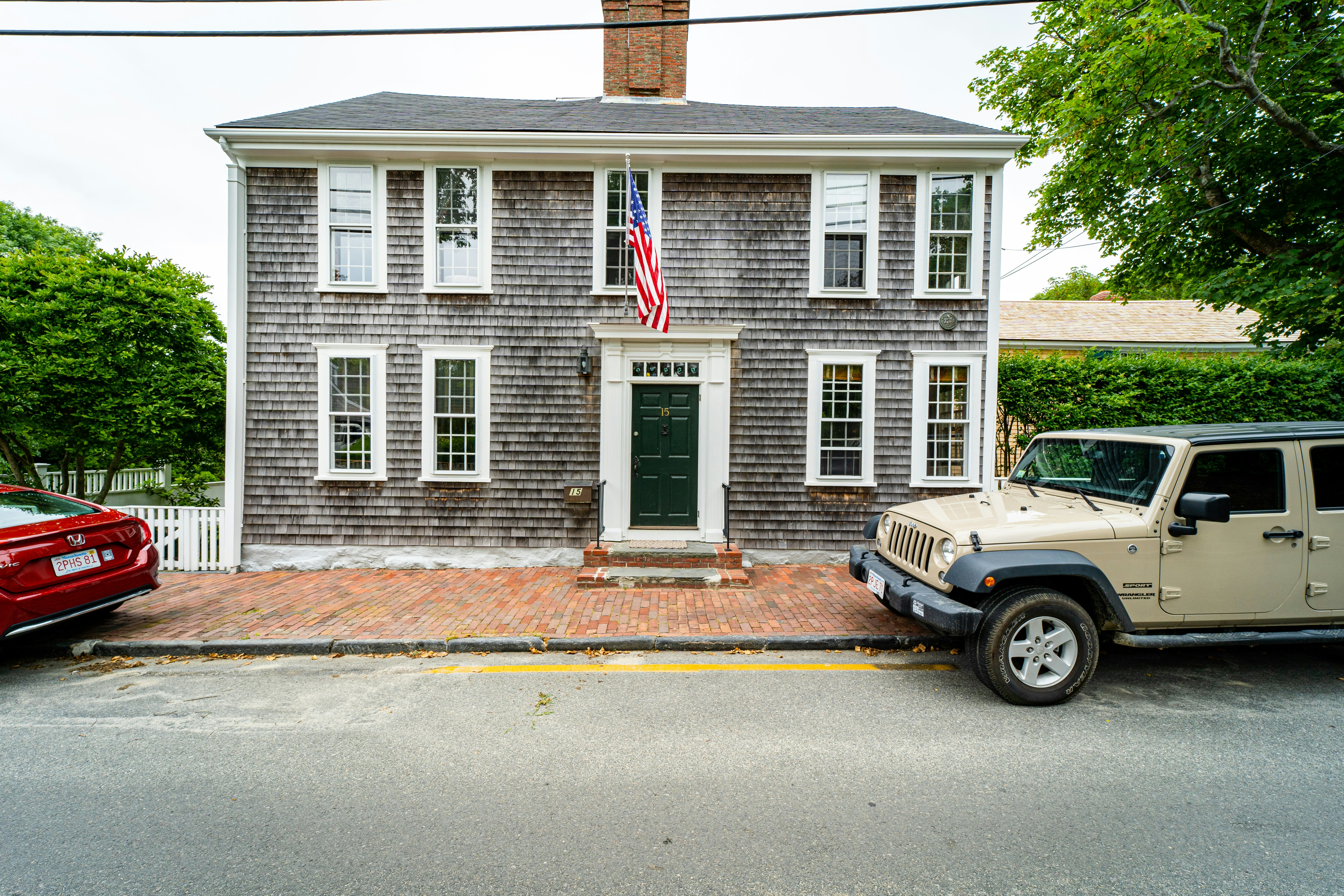 A Nantucket-Style Cottage Anchored by a Central Front Door
