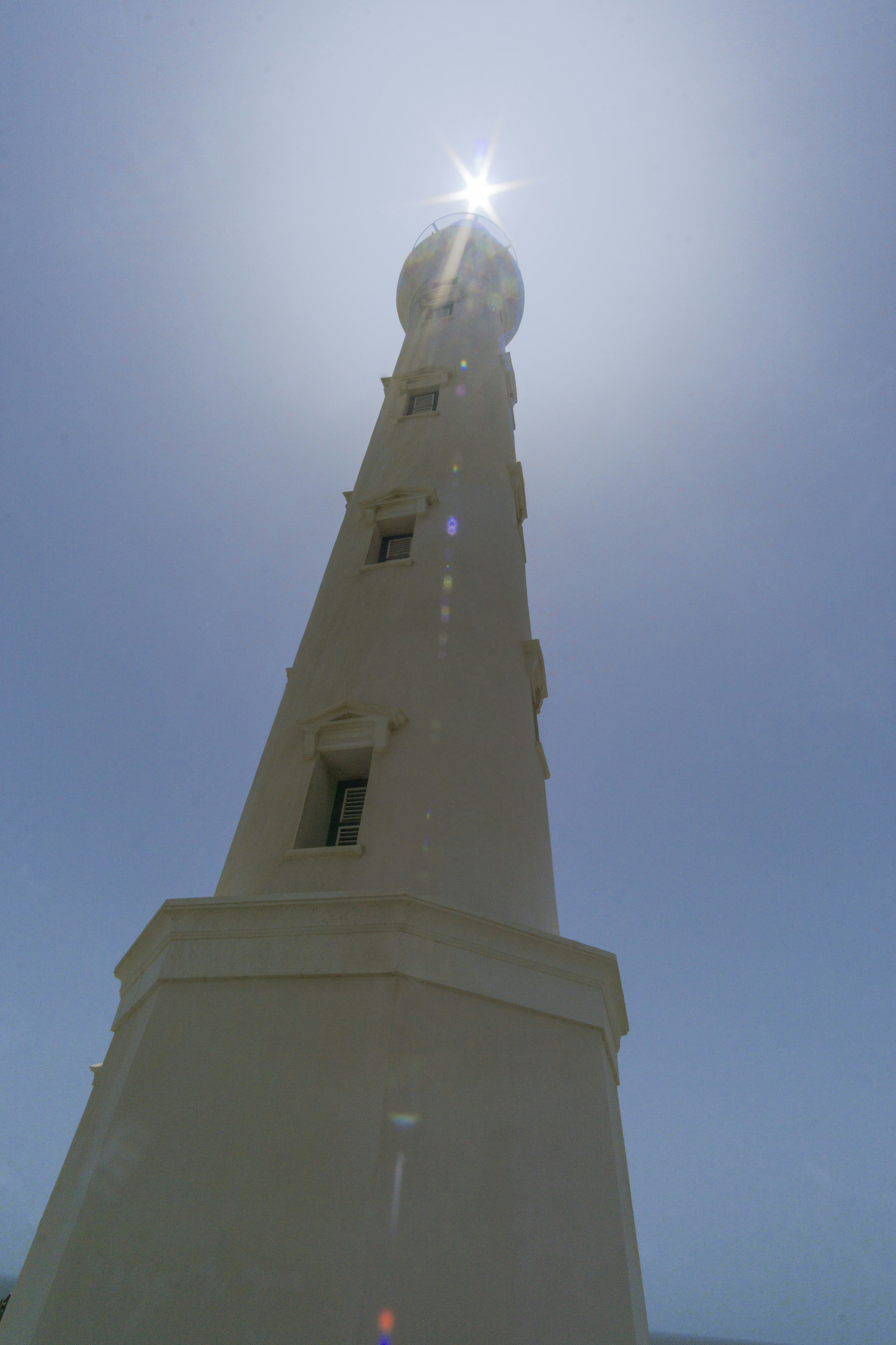 white concrete tower under blue sky during daytime