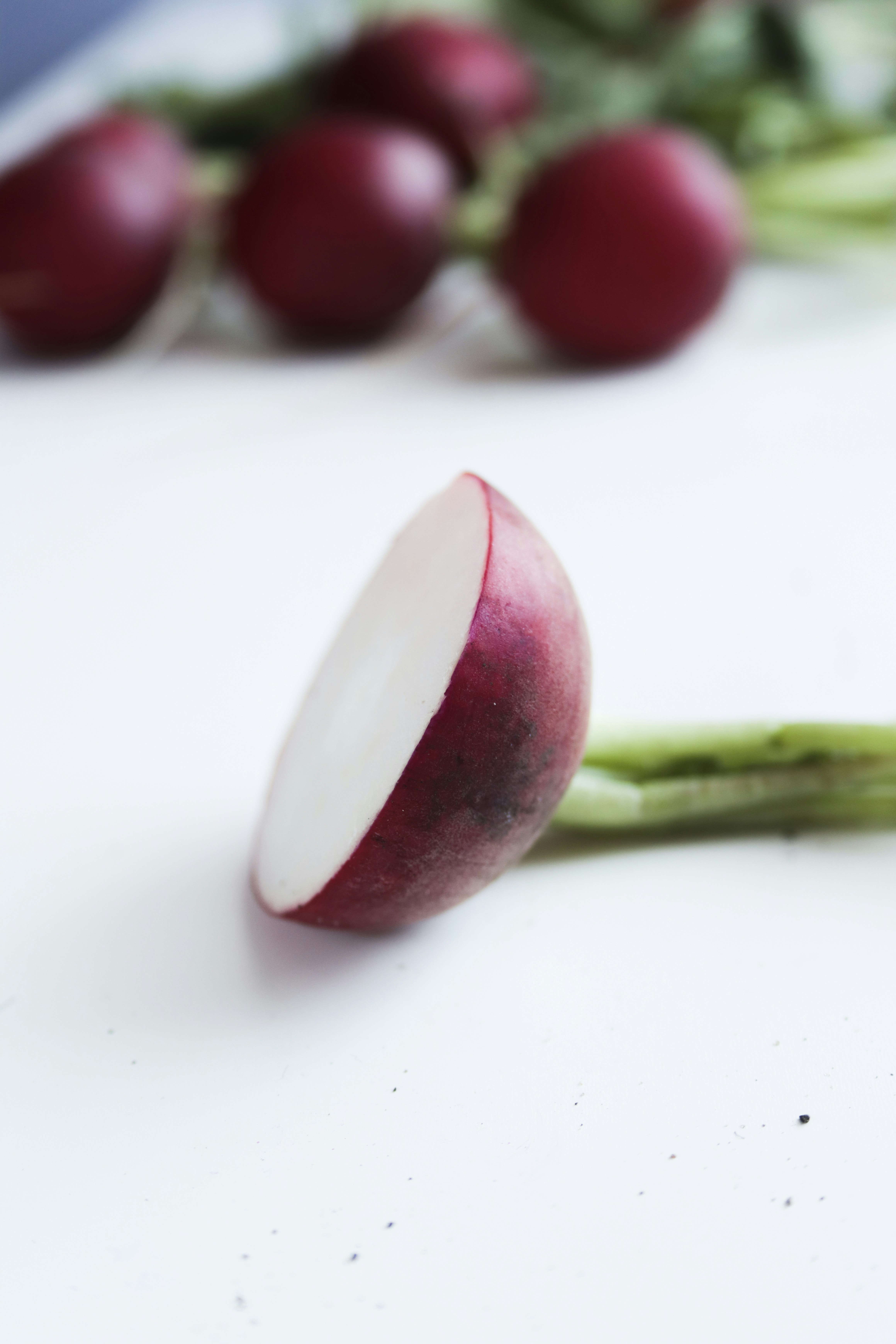 Radish Slice in Focus: A Minimalist Still-Life with Rosy Accents