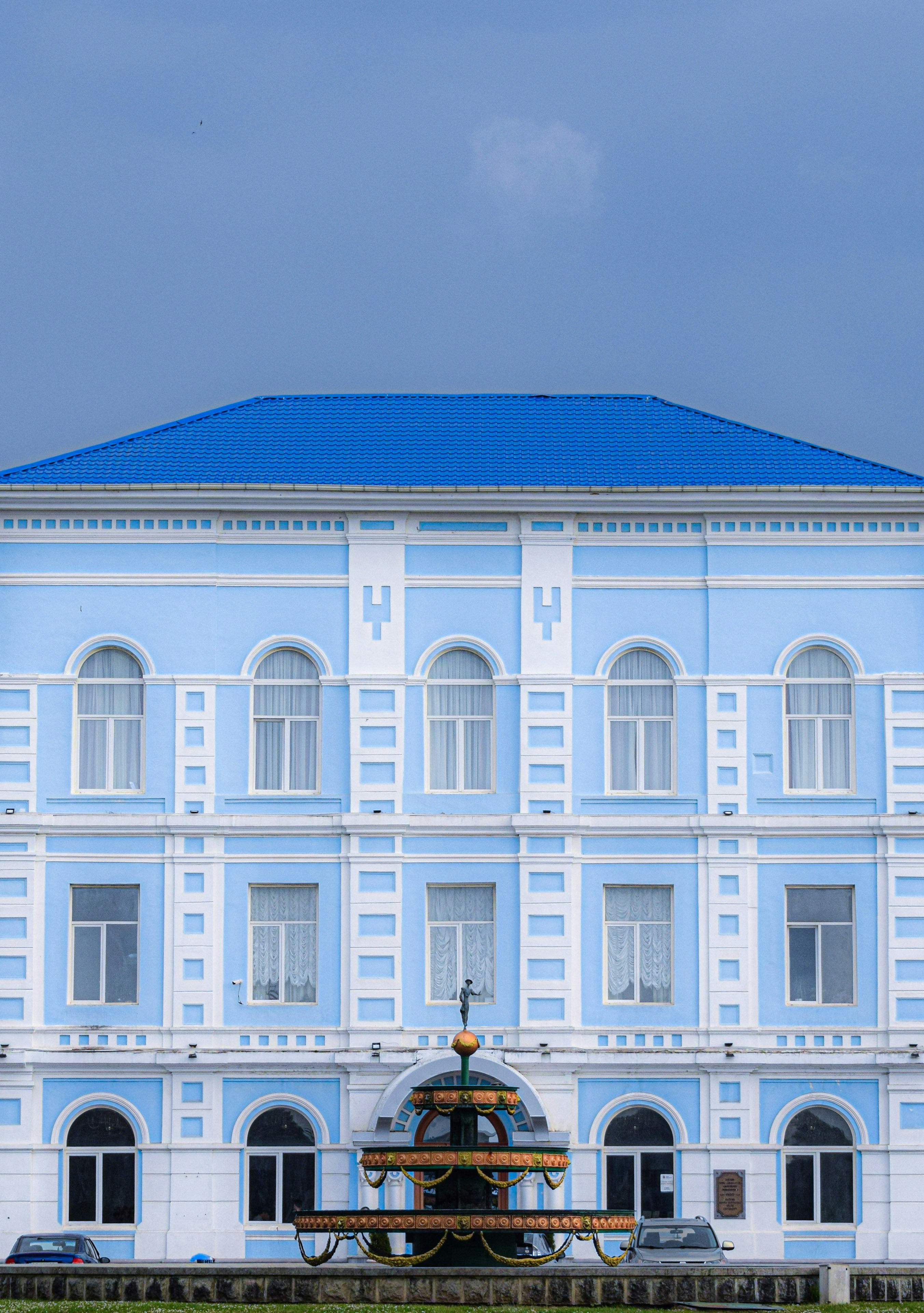 Azure Facade, Tiered Fountain: A Quiet Study in Pastel Symmetry