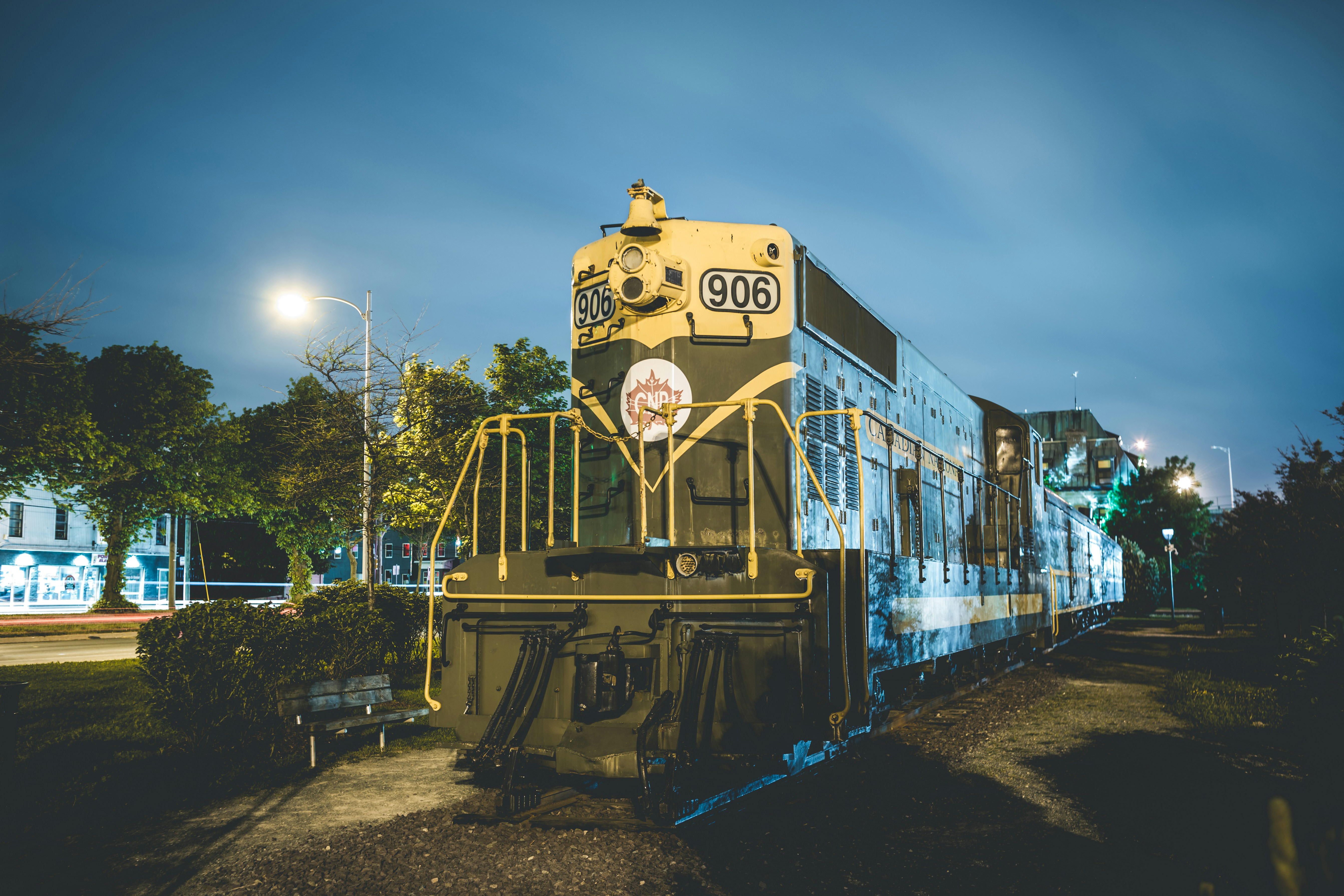 Blue Hour Locomotive at Rest in a Quiet Park Under Streetlights