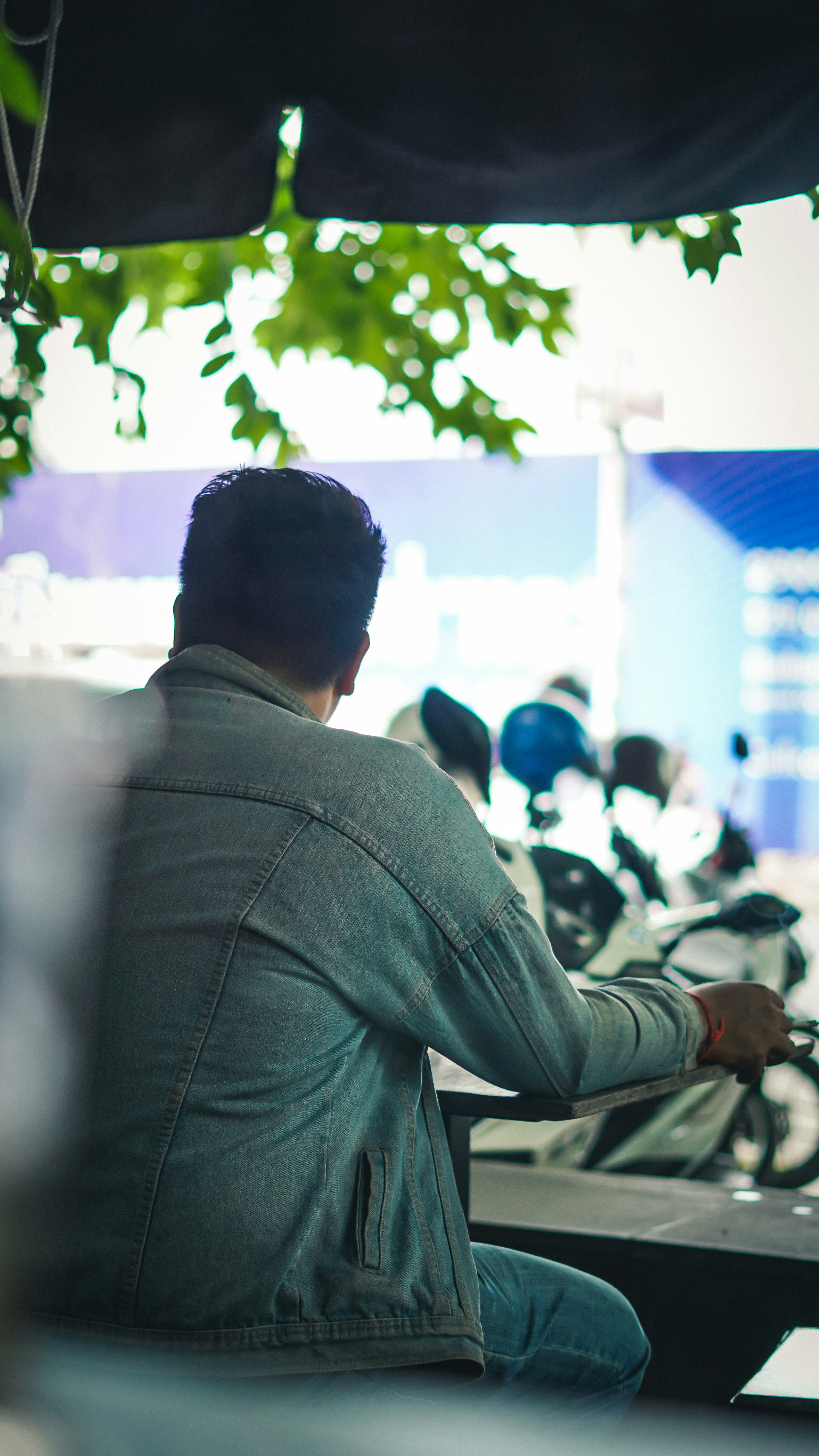 a man sits on the chair while smoking