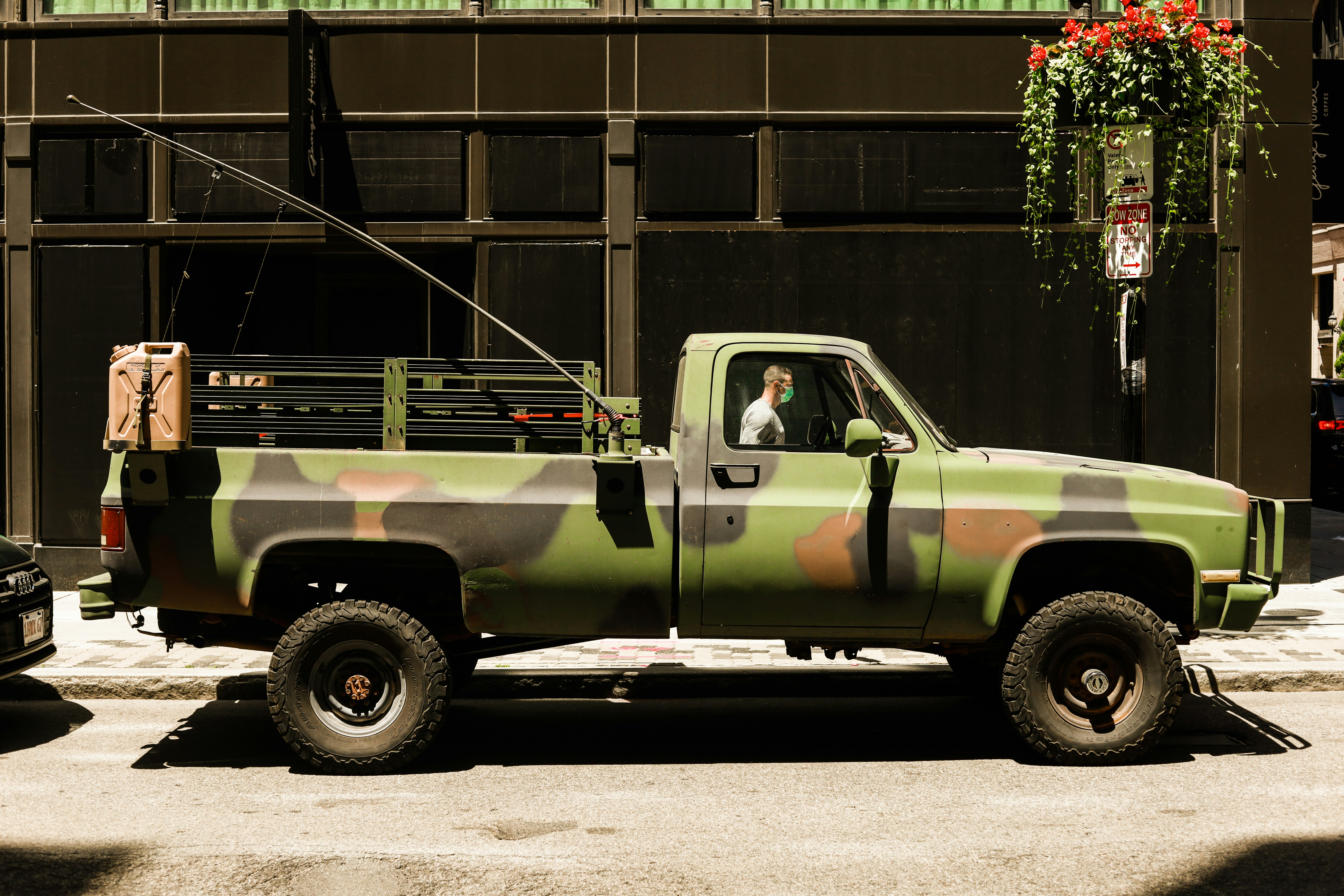 green and white single cab pickup truck