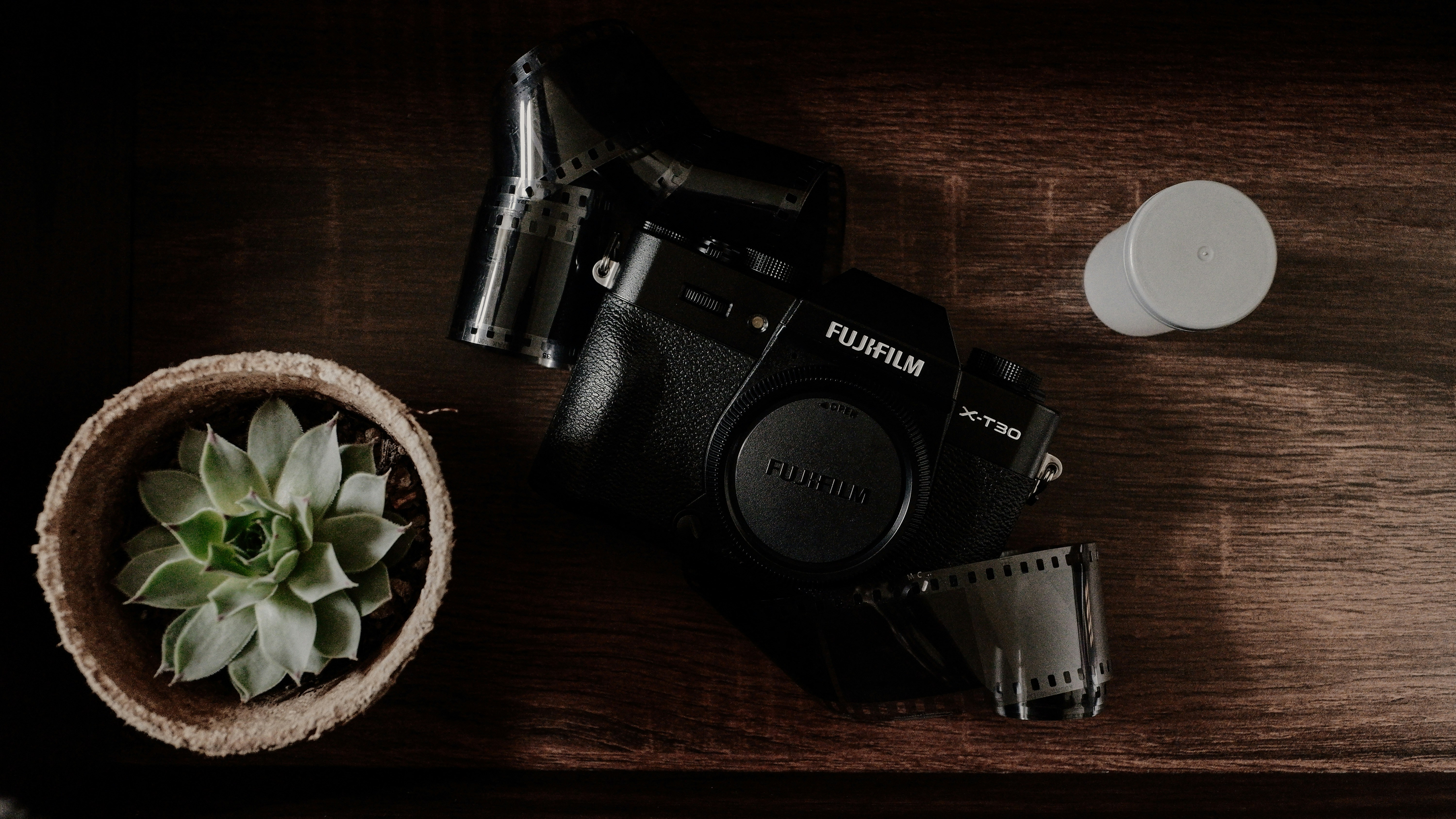 Black nikon dslr camera on brown wooden table photo – Free Black Image ...