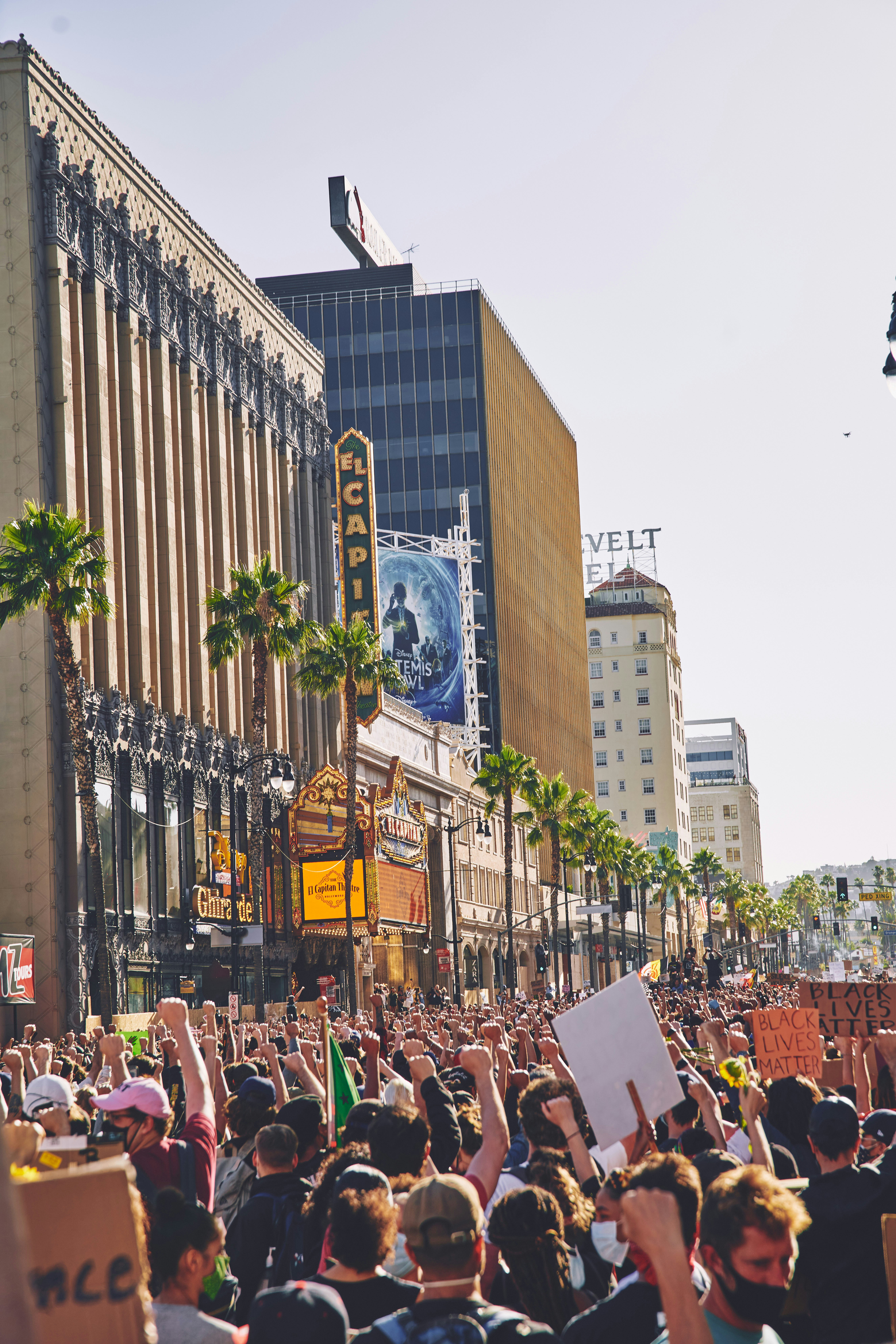 Crowd Surge in Front of Historic Theater Lane