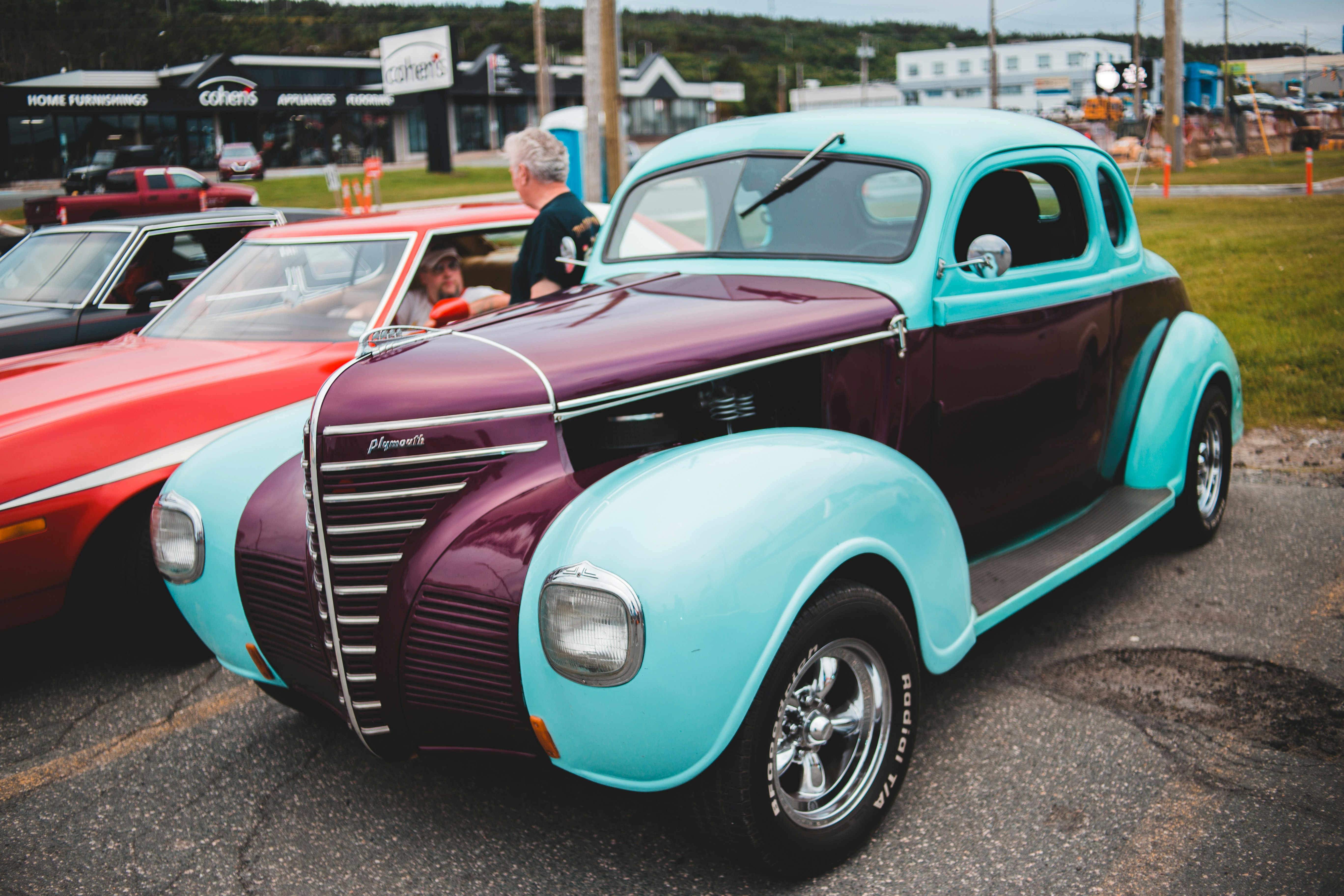 Turquoise-era Convertible: A Bursting Vintage Car at a Classic Car Show