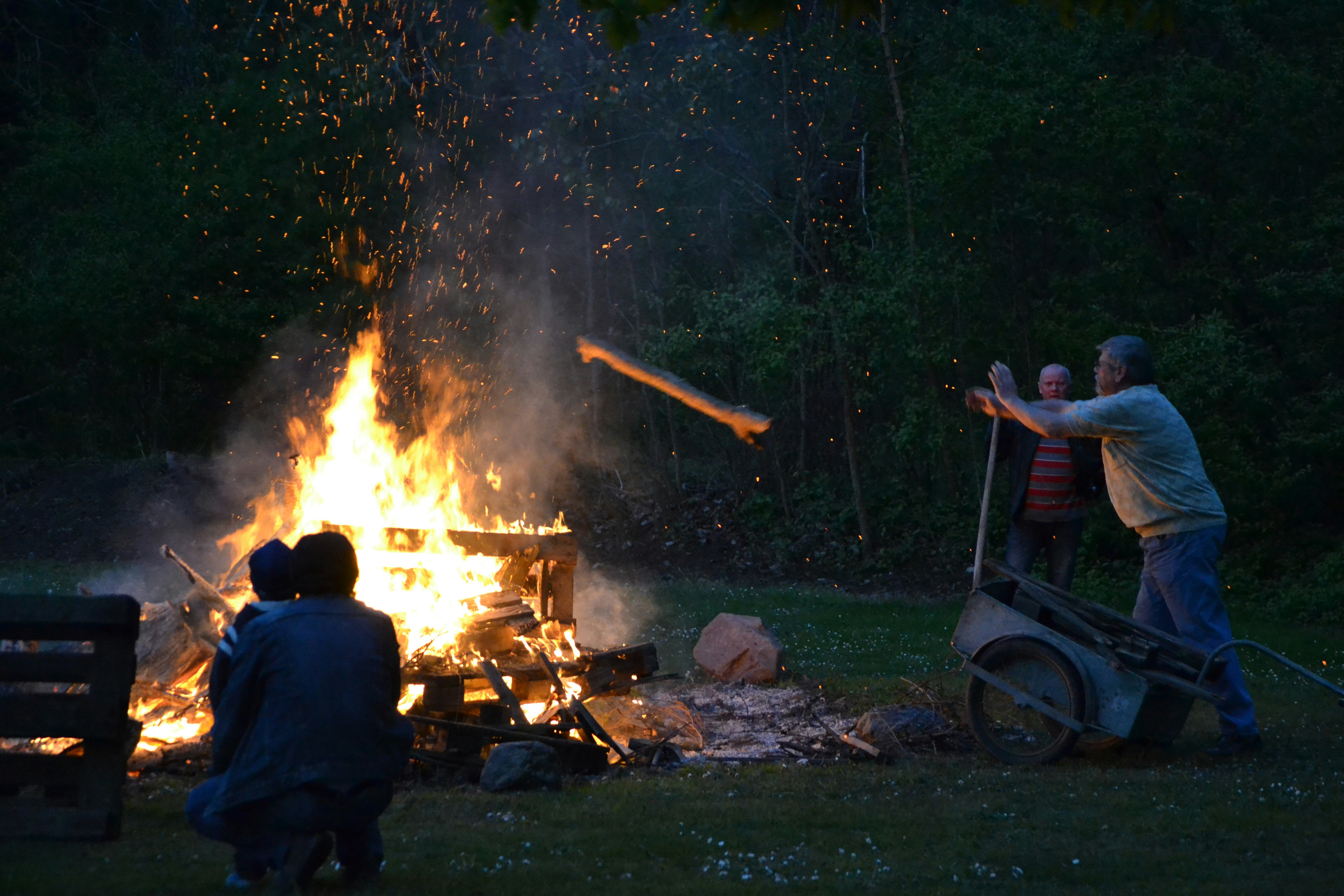 Midnight Bonfire: Sparks, Silhouettes, and a Wheelbarrow