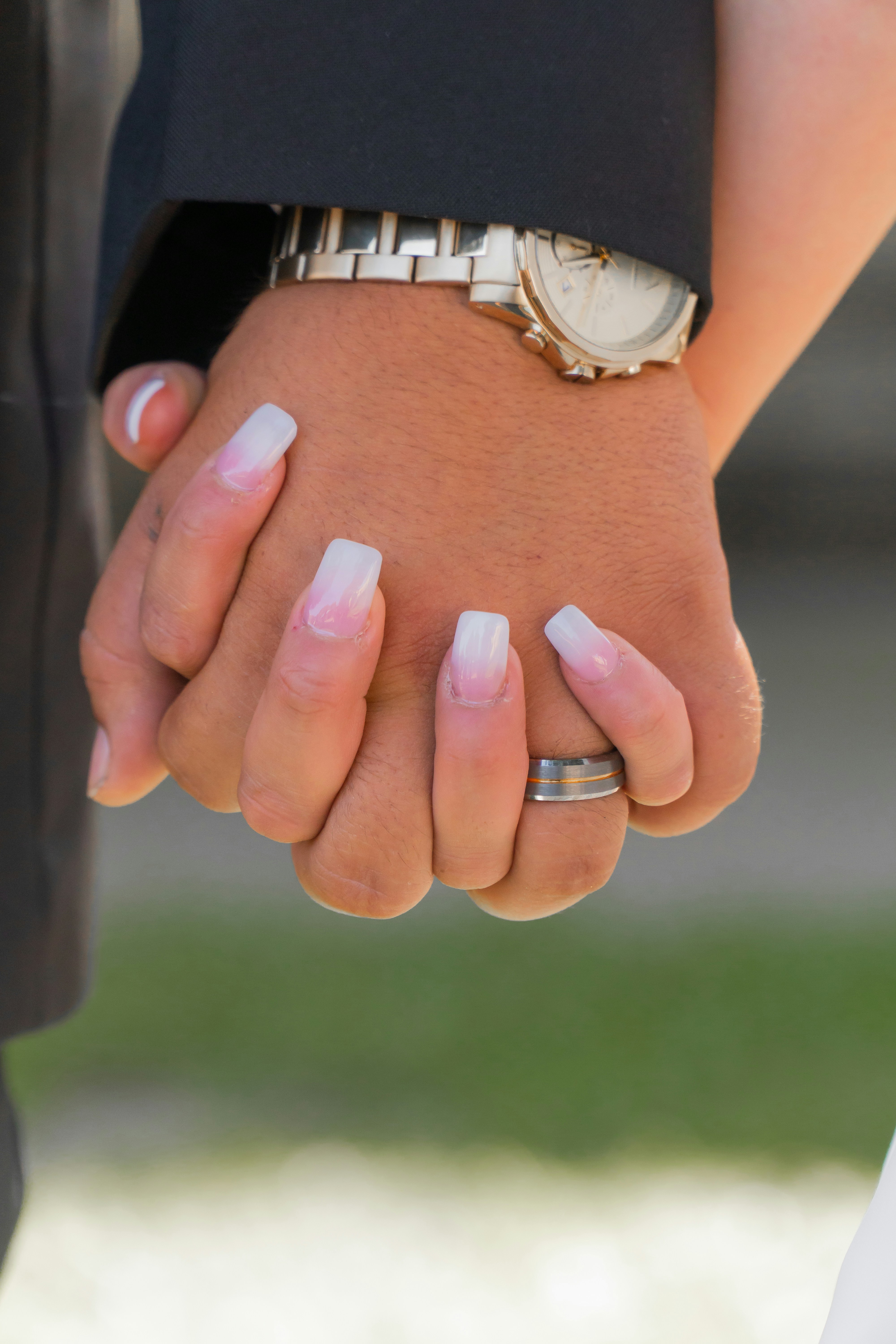 Person wearing gold and silver watch photo – Free Holding Image on Unsplash