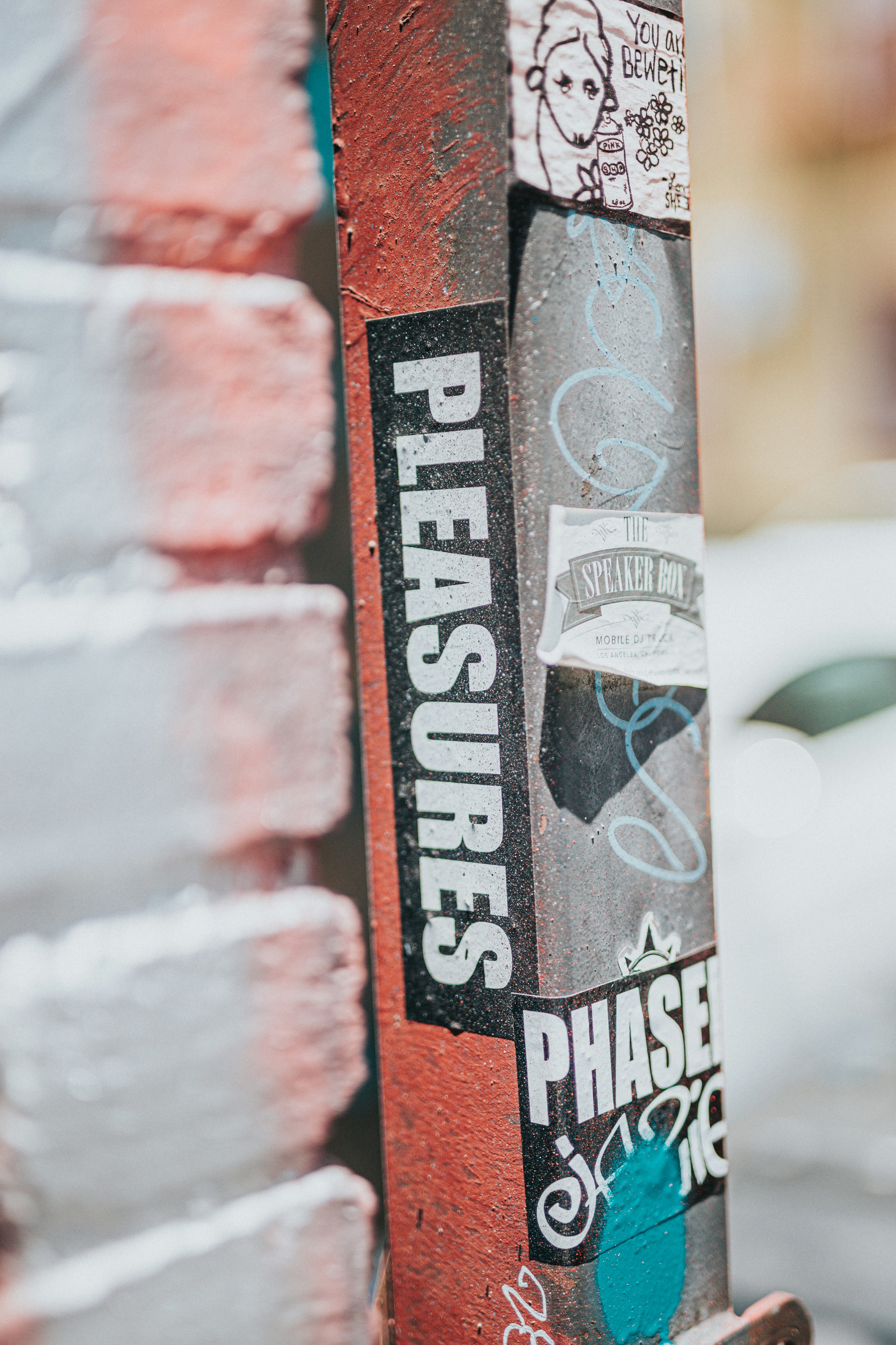 Stickered Pole: A Vertical Slice of Urban Decals