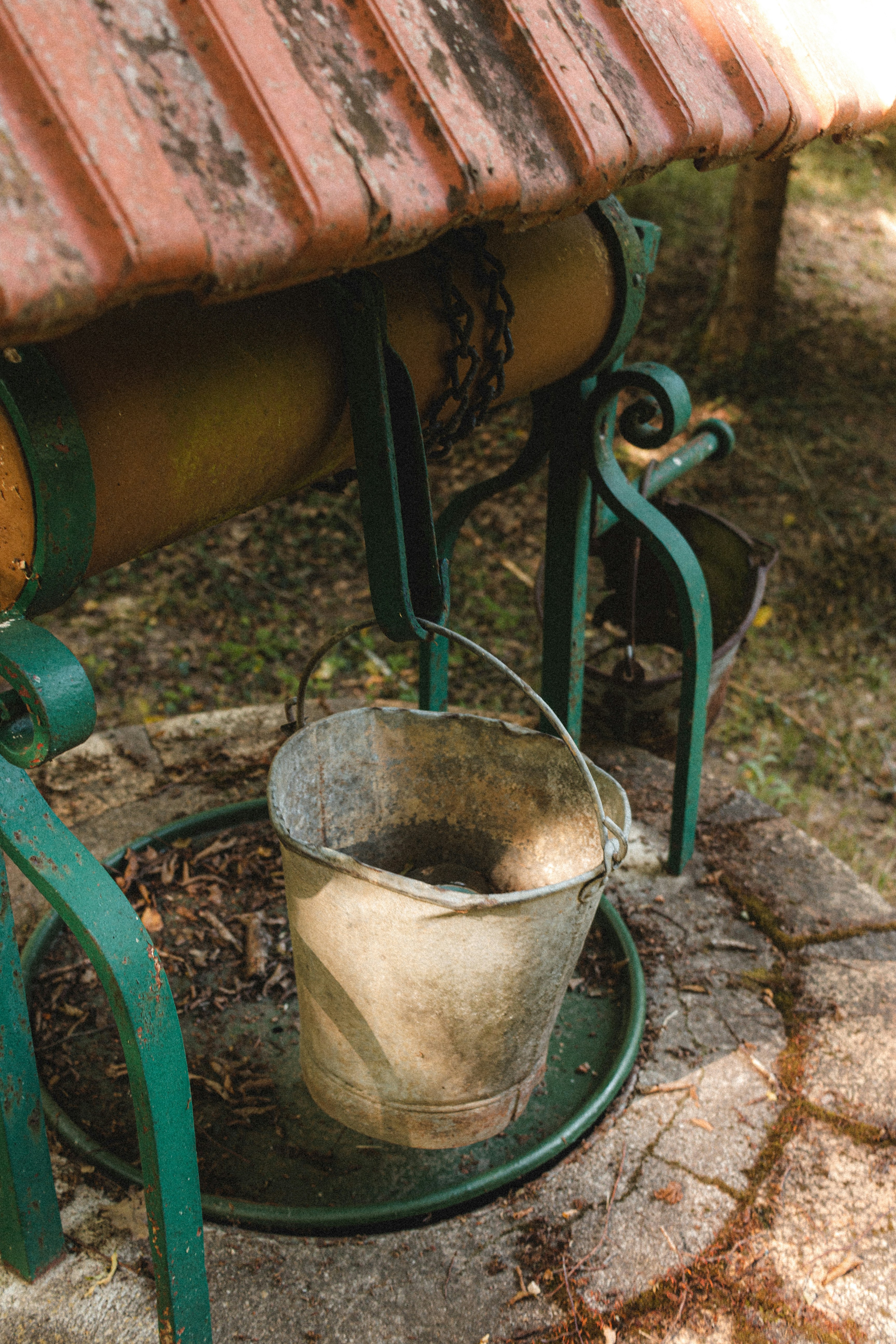 Stainless steel bucket on green metal pipe photo – Free France Image on ...