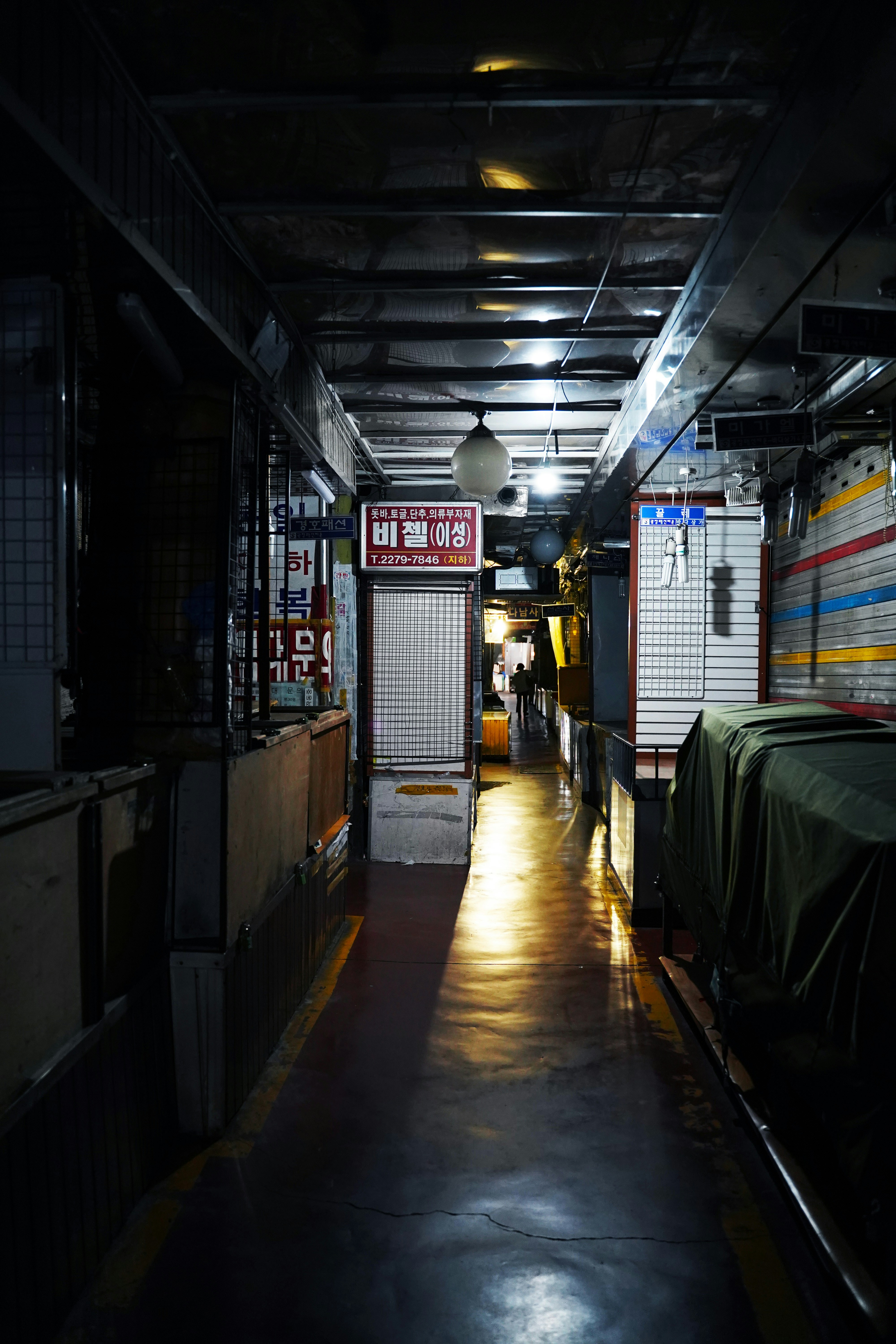 End of the Market Corridor: Neon Signage and a Silent Walkway