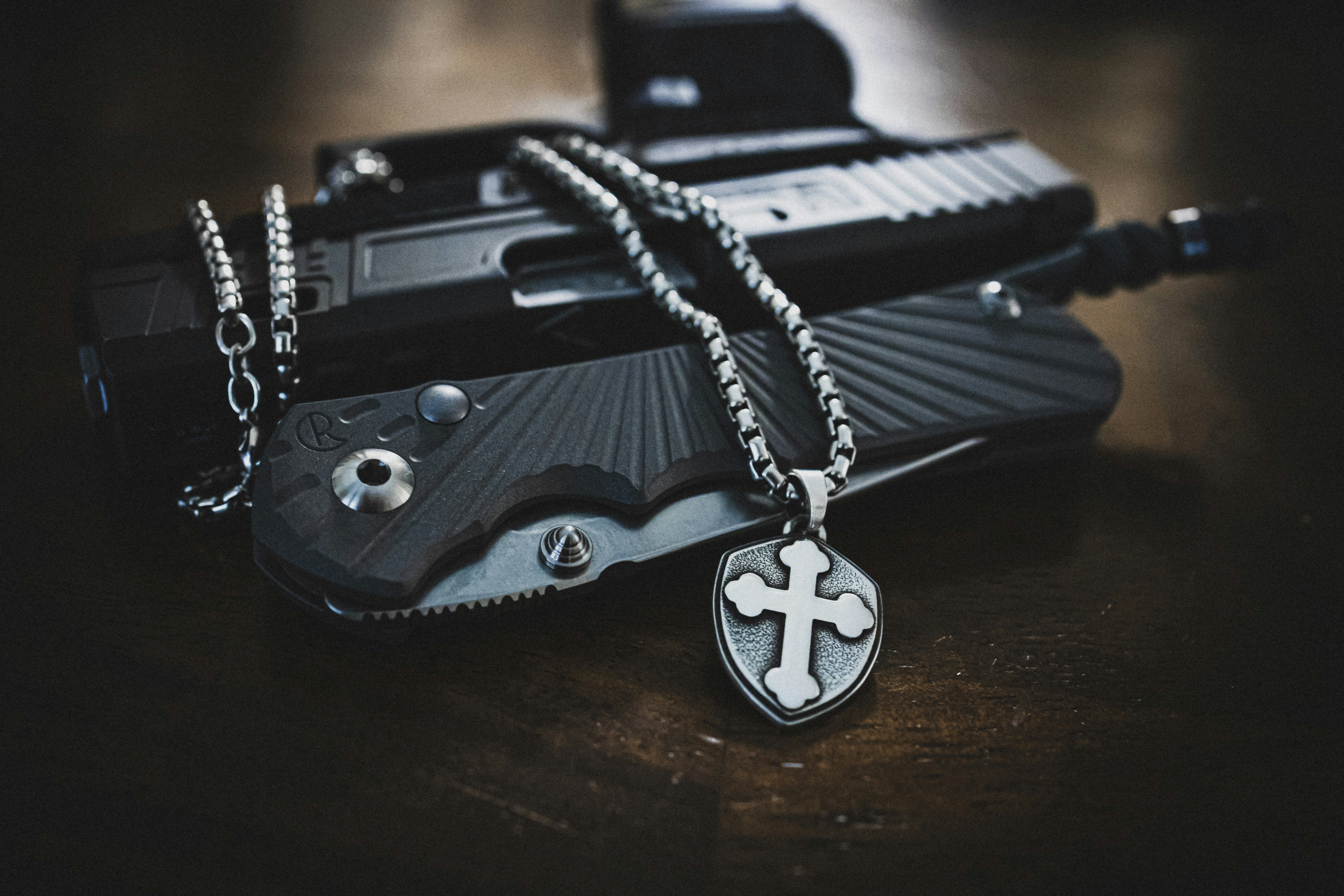 Chain-and-gun: A pendant rests on a hidden weapon