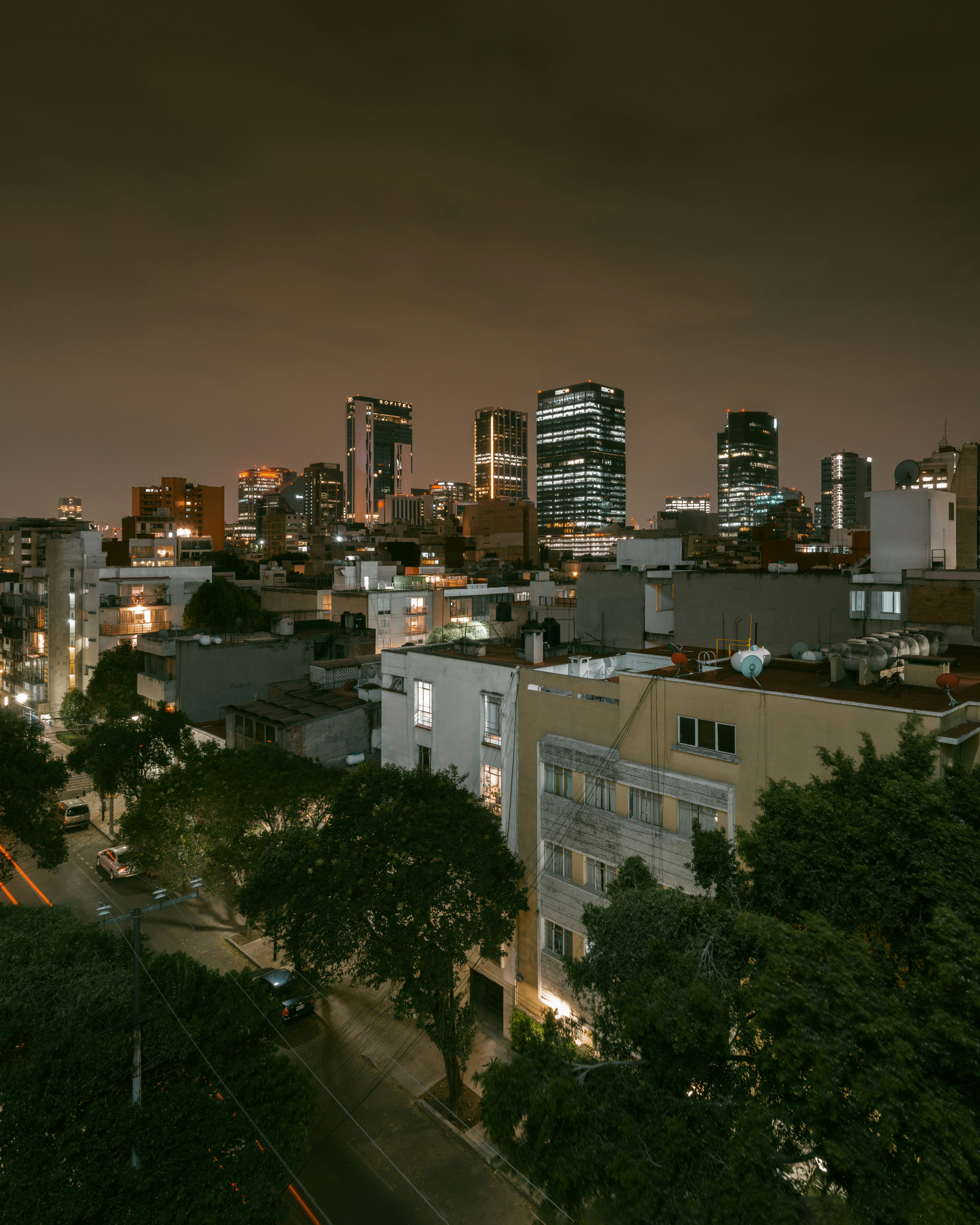 City with high rise buildings during night time photo – Free City Image ...