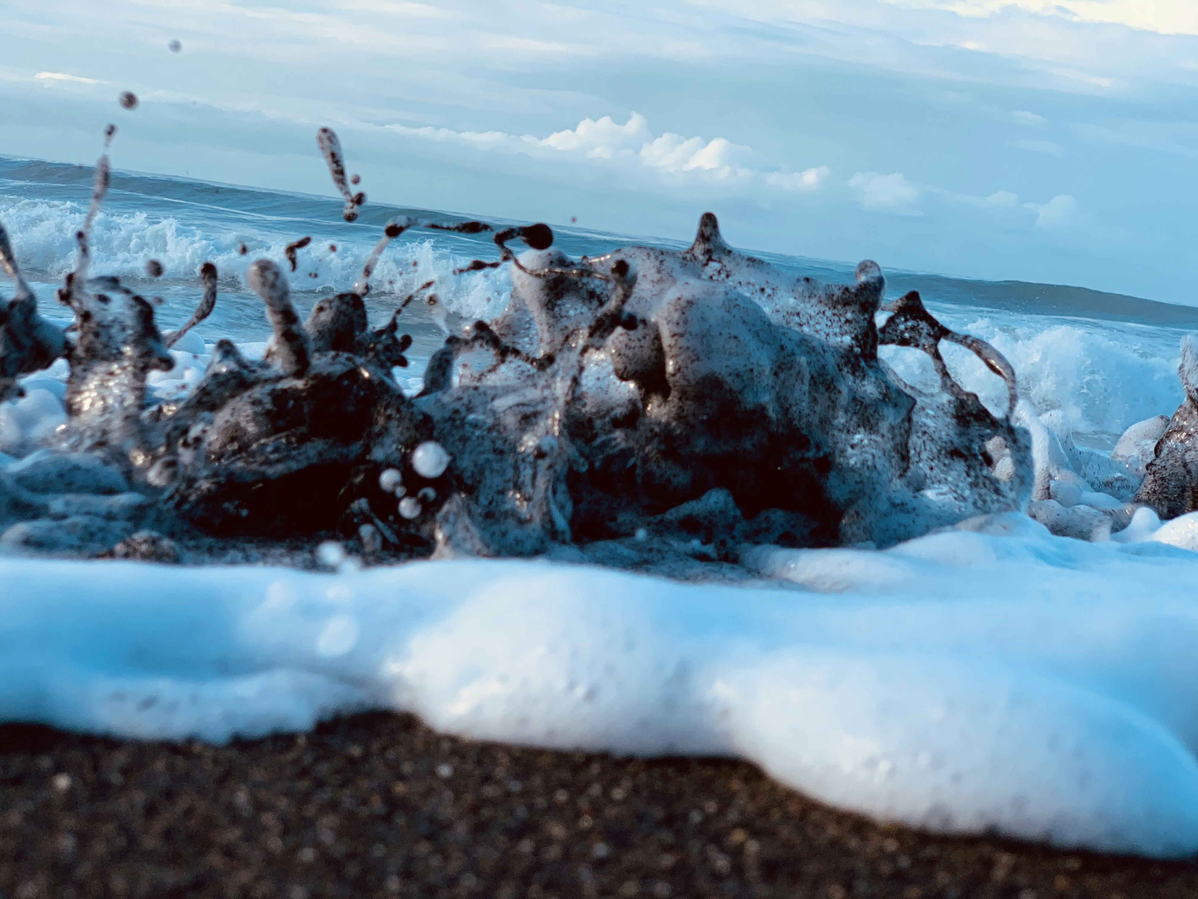 Cresting Foam: Tide Break at the Shoreline