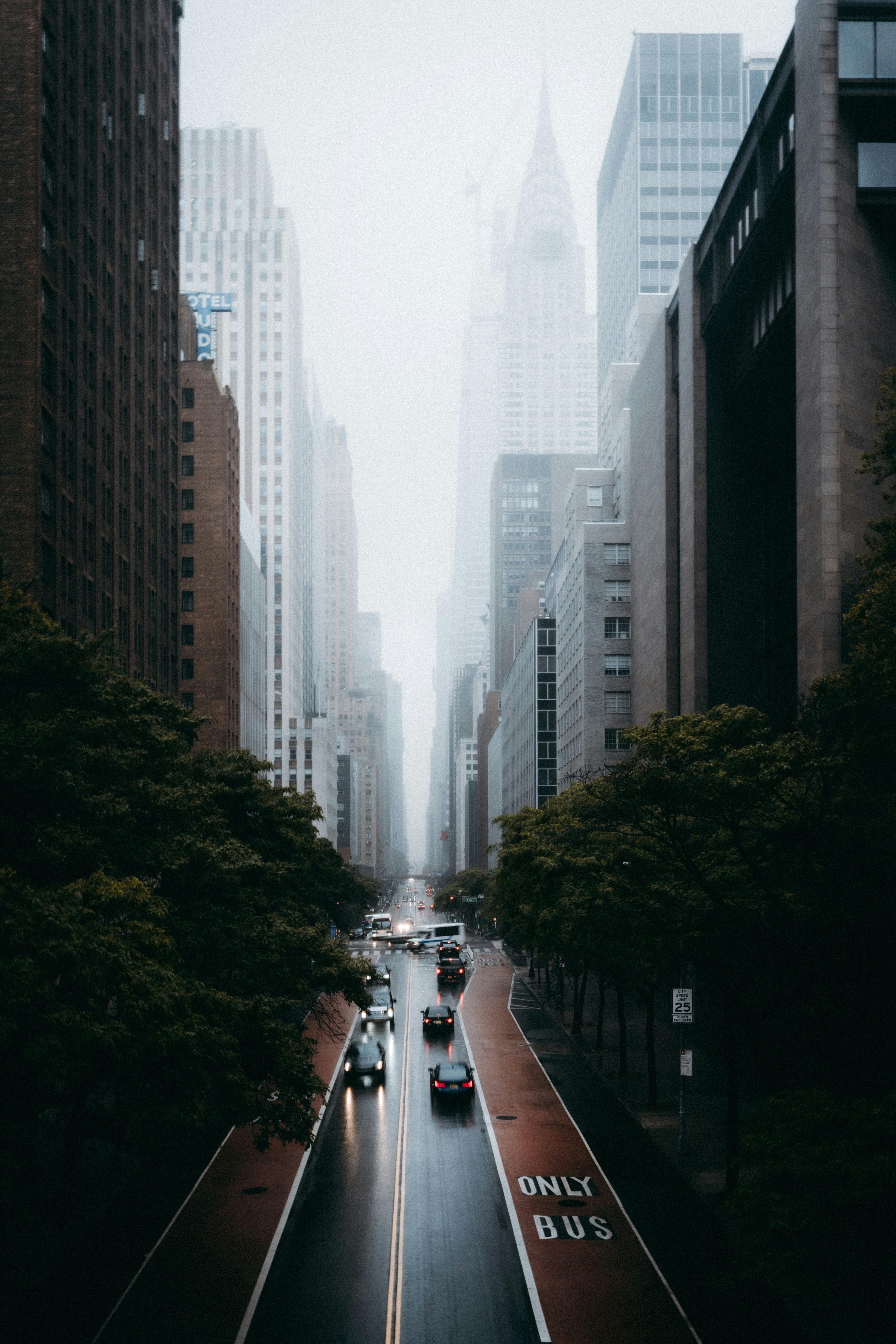 People walking on sidewalk near high rise buildings during daytime ...