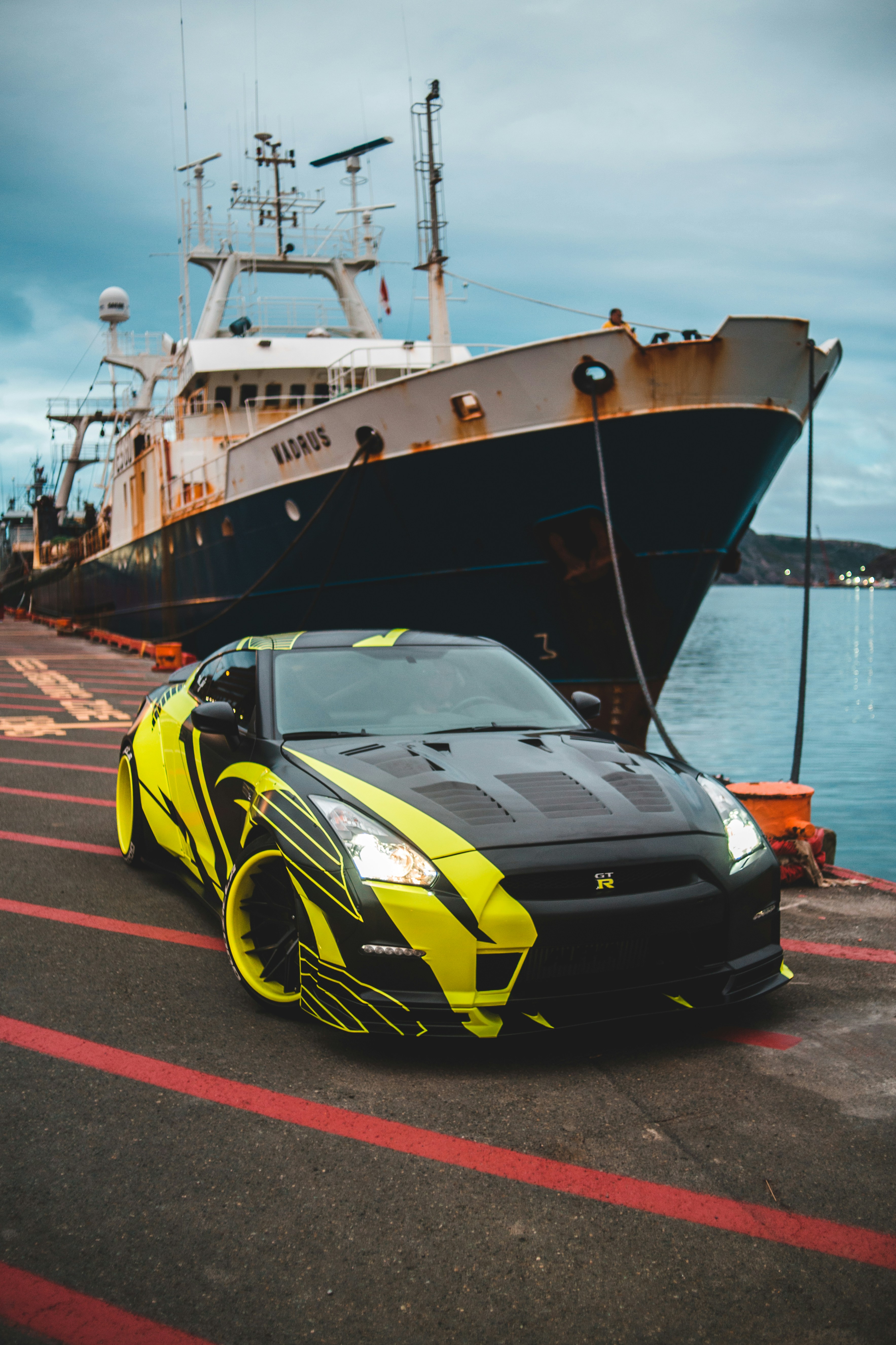 Black and yellow sports car on dock during daytime photo – Free Boat ...