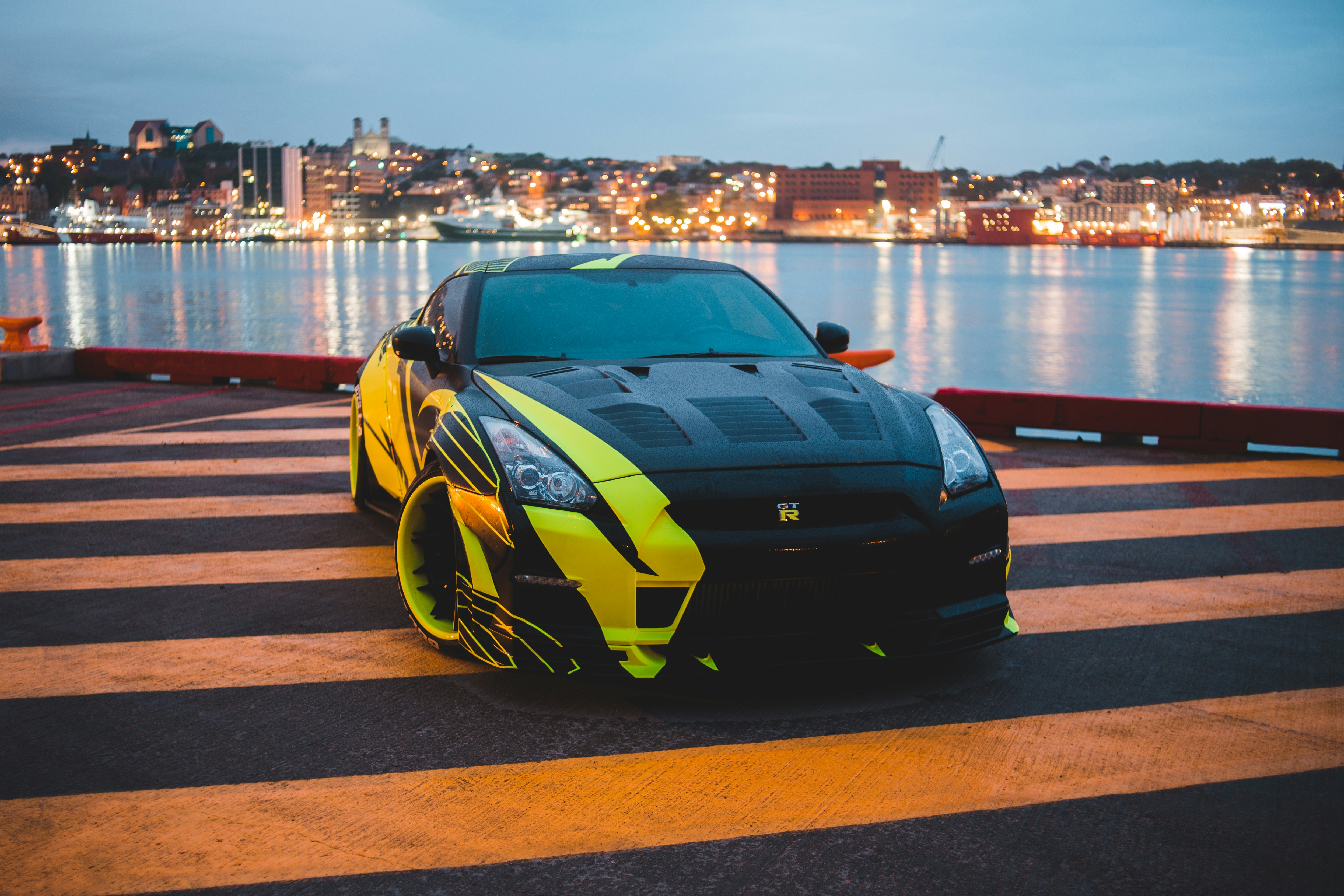  Neon Stripes by the Waterfront: A Hypercar at Dusk