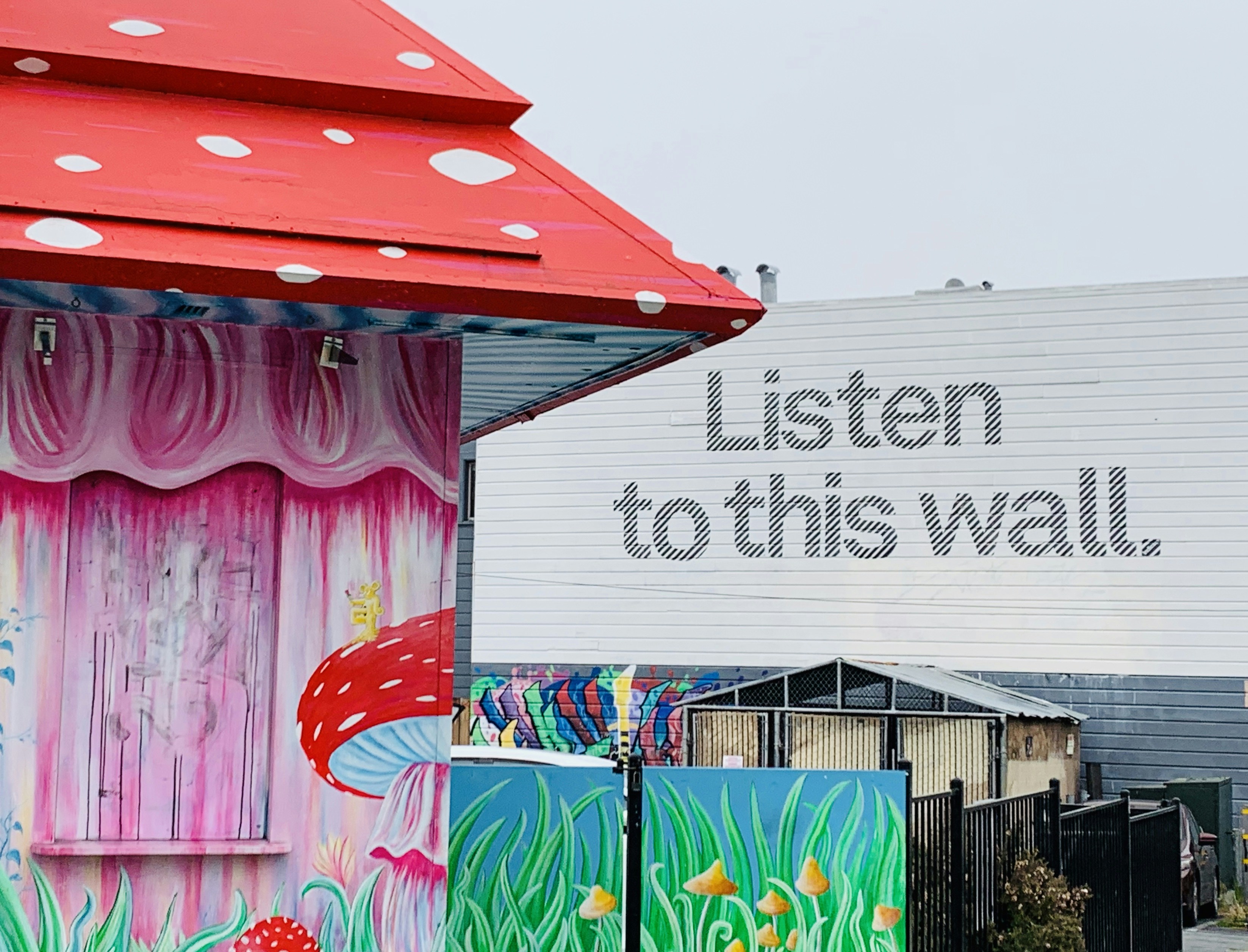 Listen to This Wall: A Polka-Dot Roof Framing a Vivid Street Mural