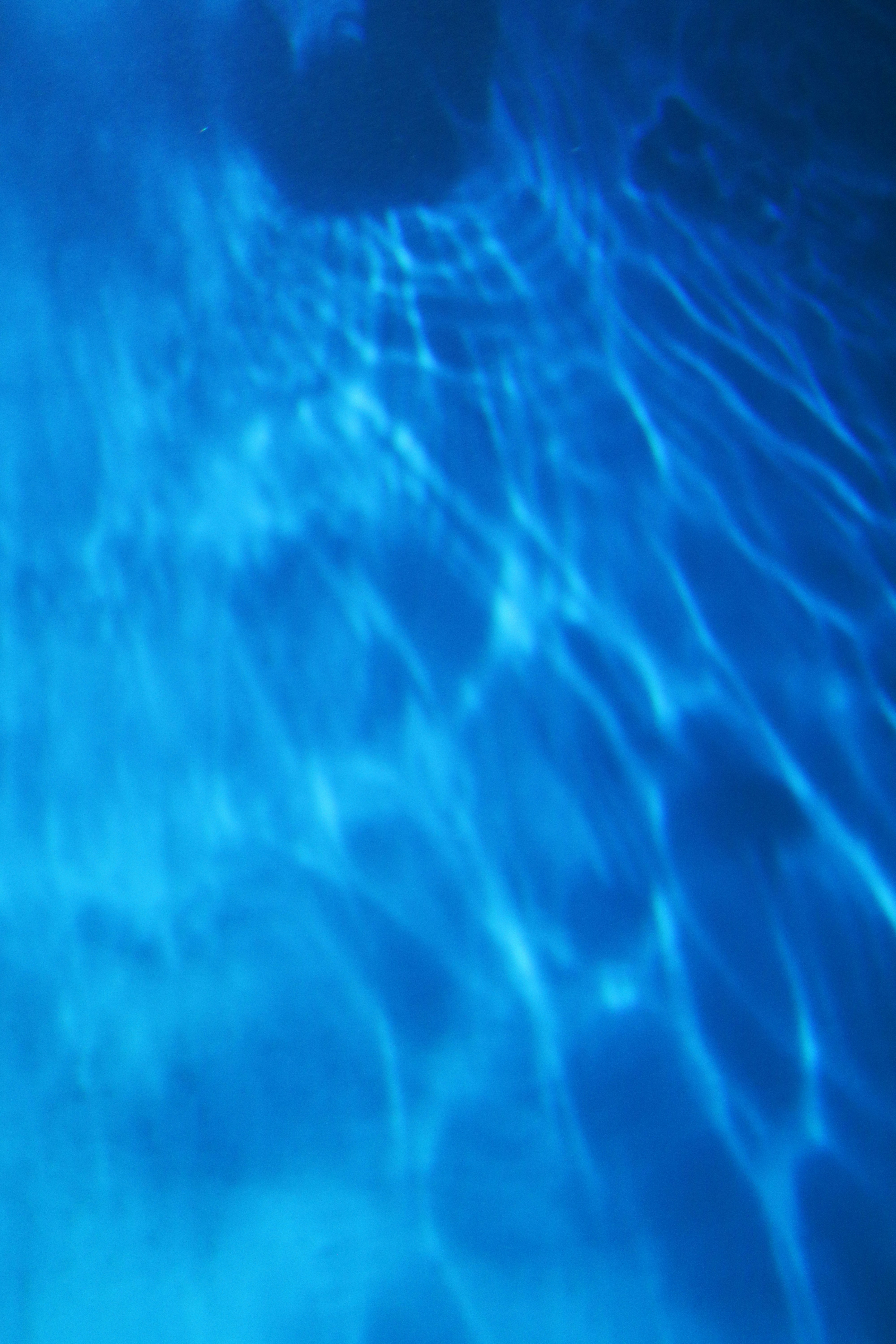Undertow of Light: Blue Ripples Beneath the Surface