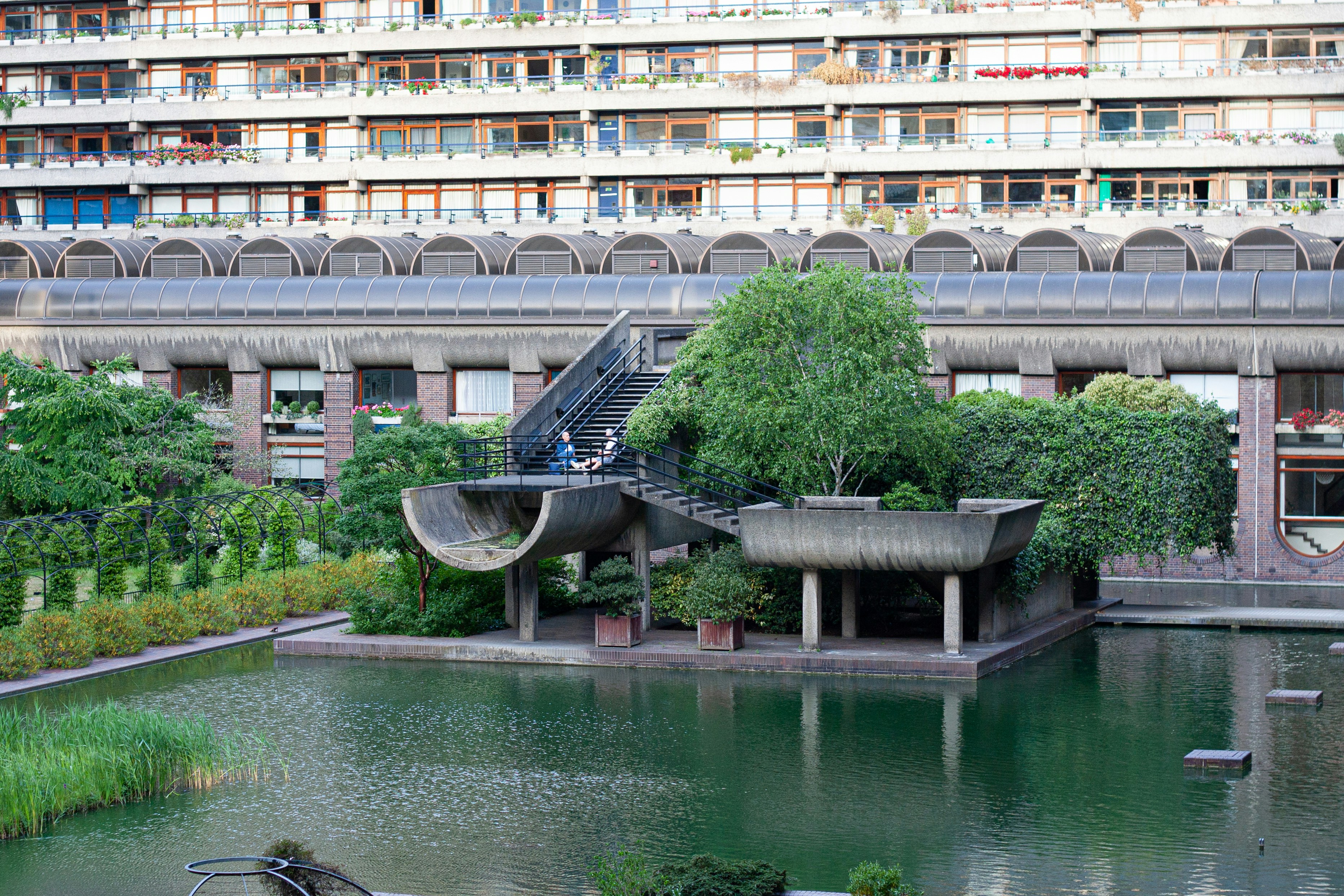 White concrete building near body of water during daytime photo – Free ...