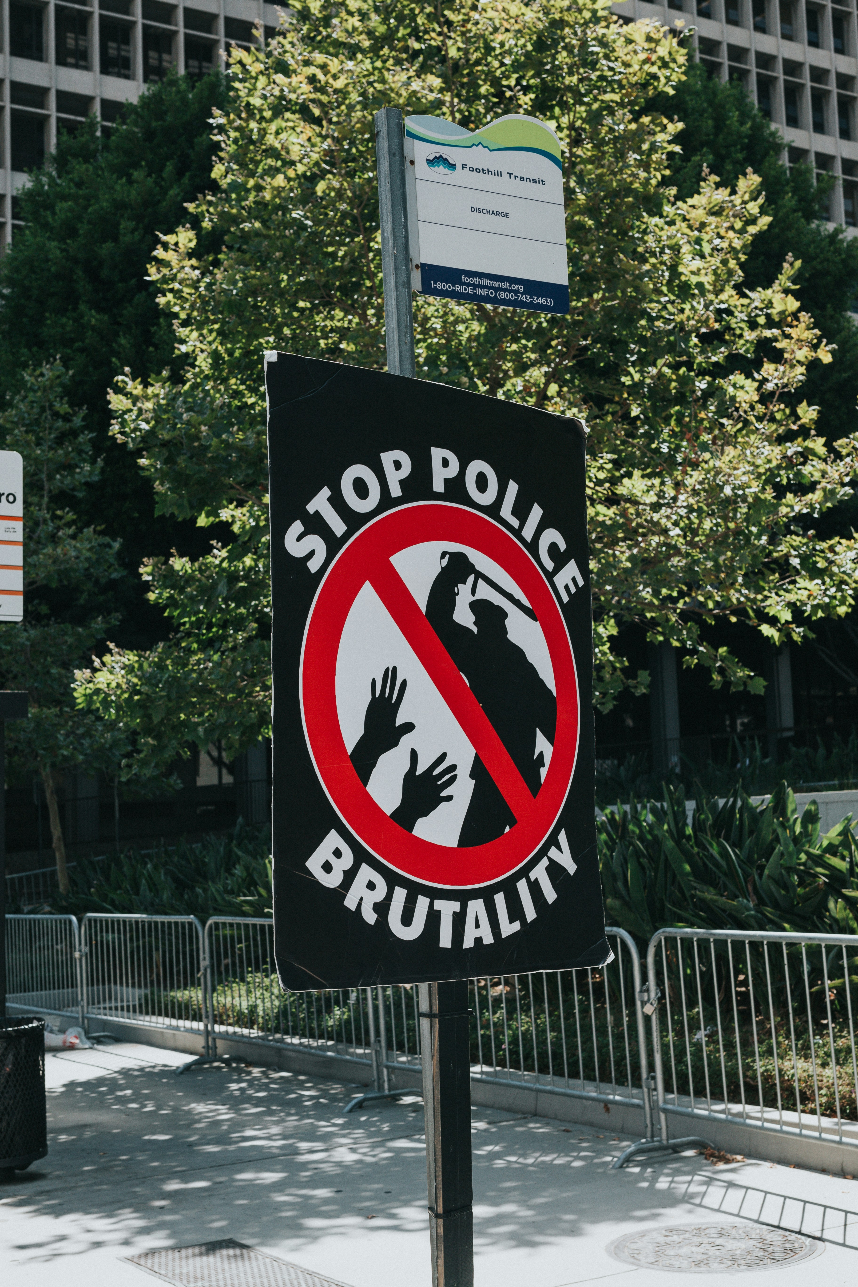 Stop Police Brutality: Sign in Front of Urban Office Block