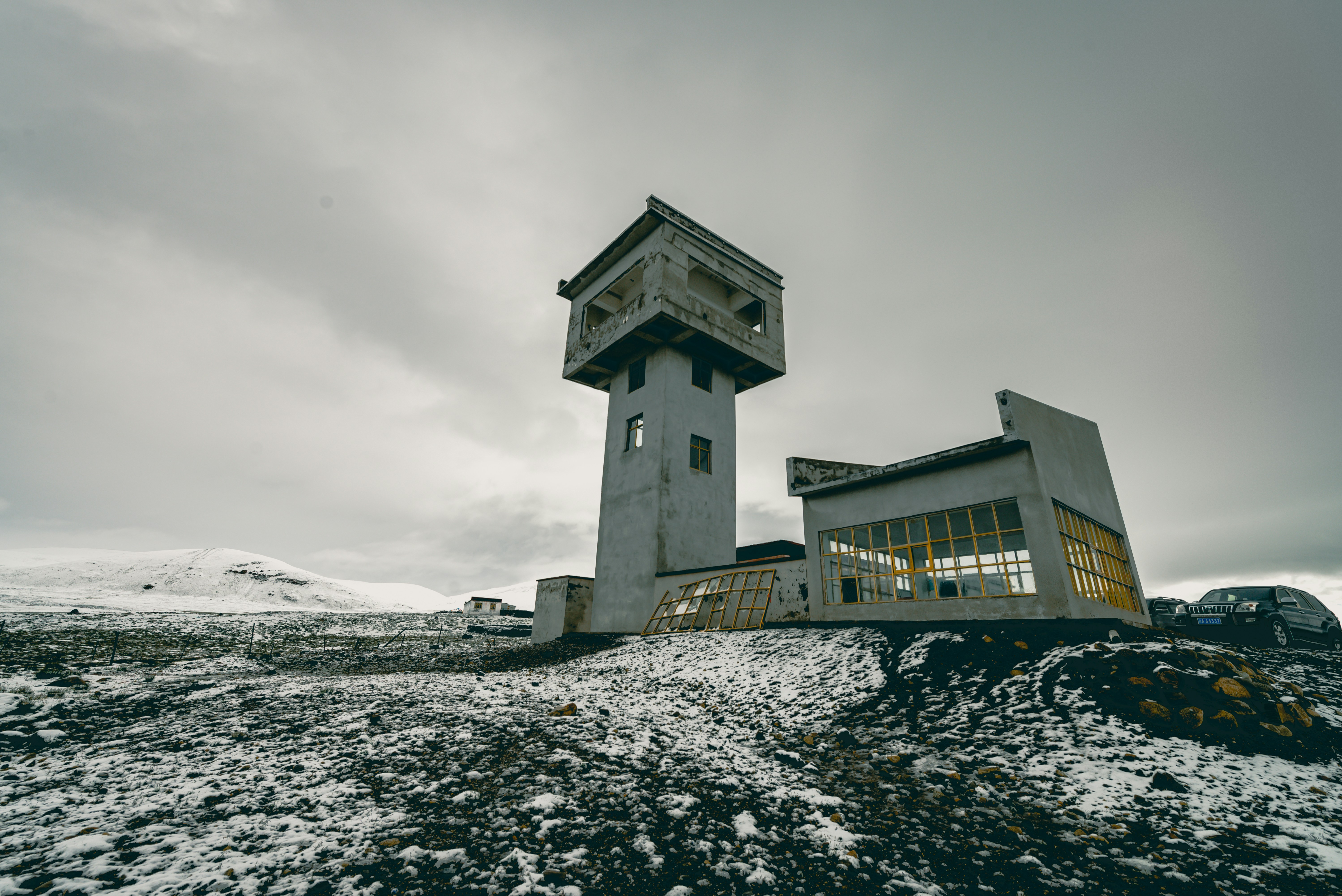 Concrete Sentinel against a Snowy Horizon
