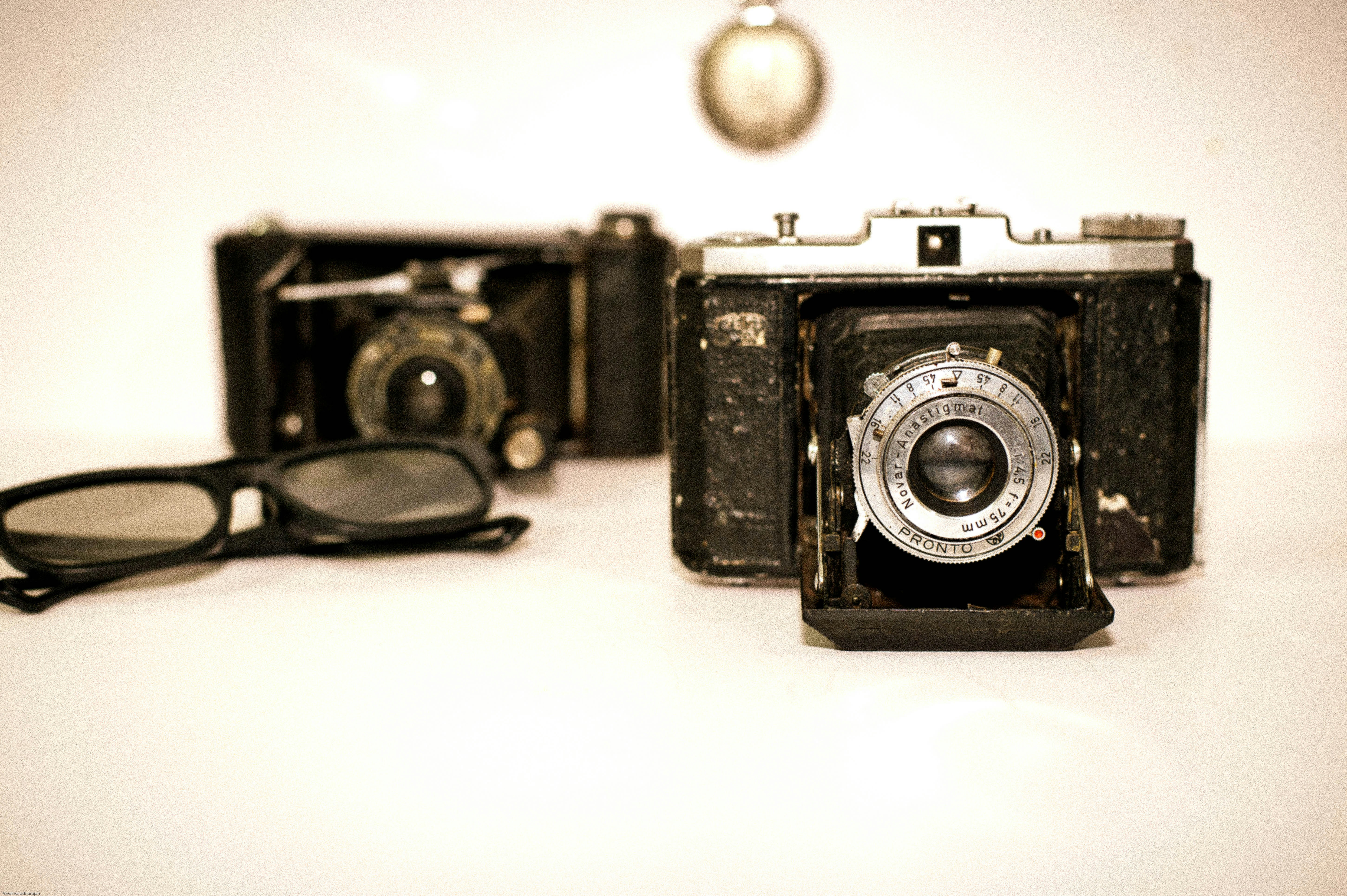 Black and silver camera on white table photo – Free Grey Image on Unsplash