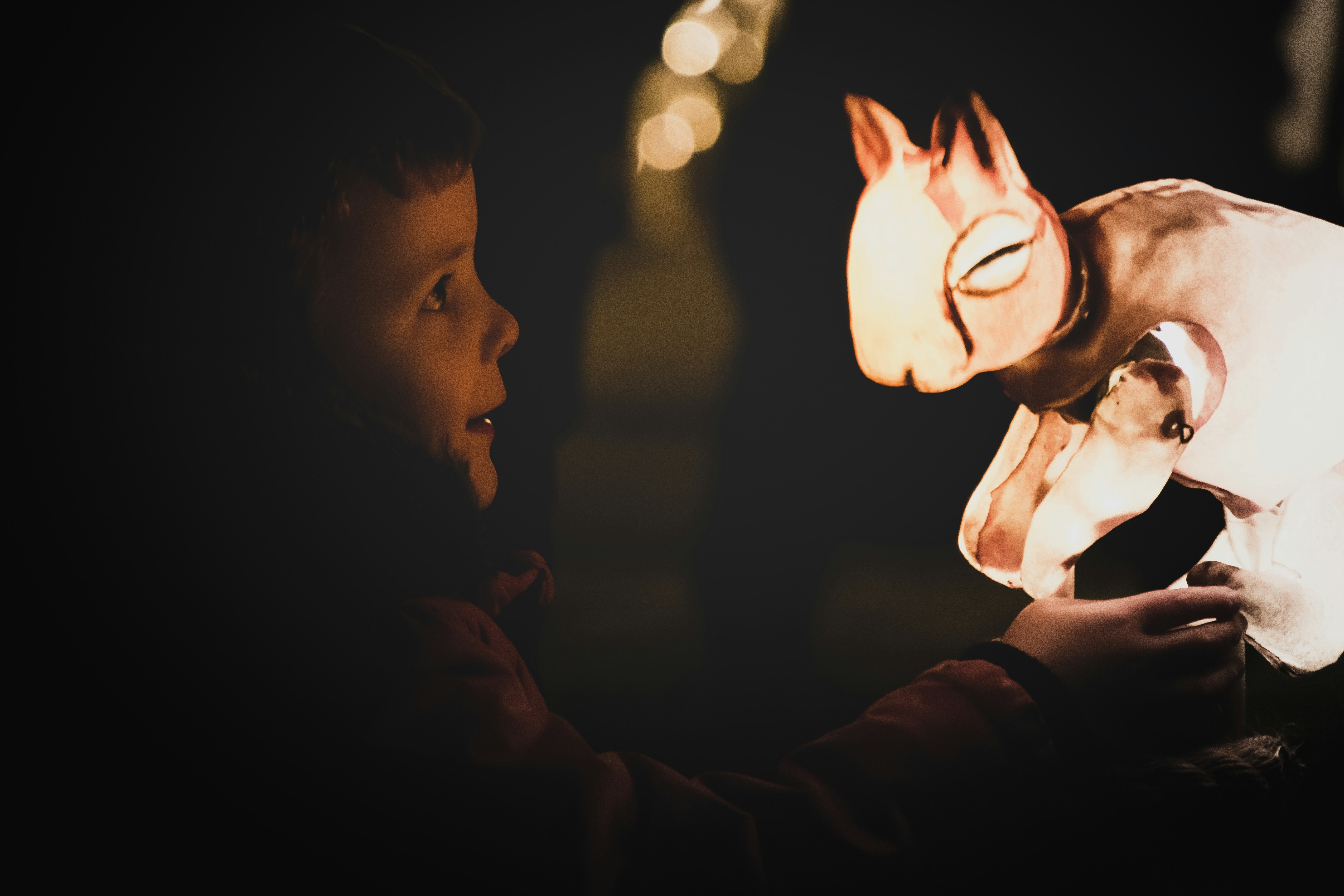 Whispered Exchange: A Child and a Puppet Horse in Night Studio