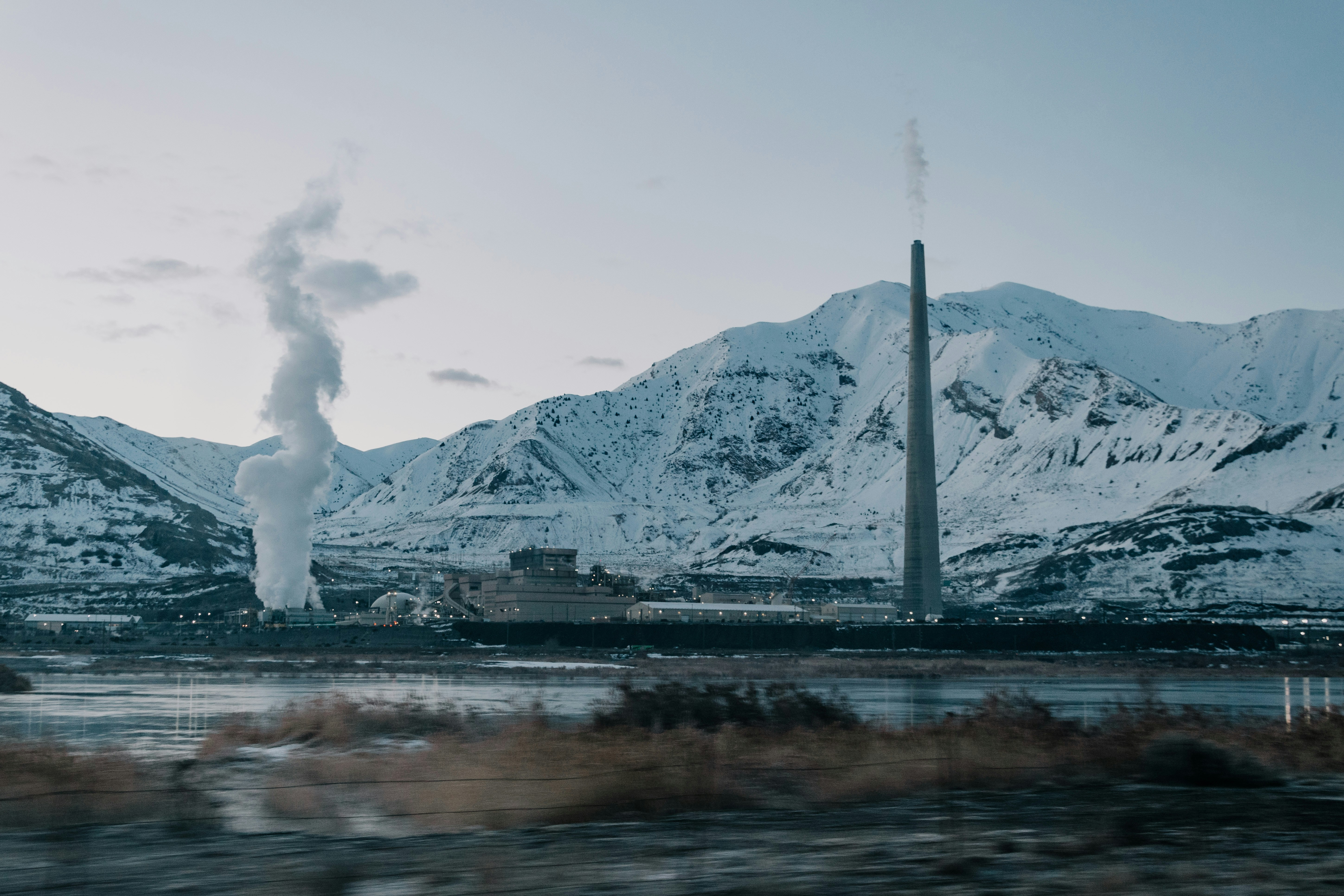 Industrial location near mountain winter time with snow