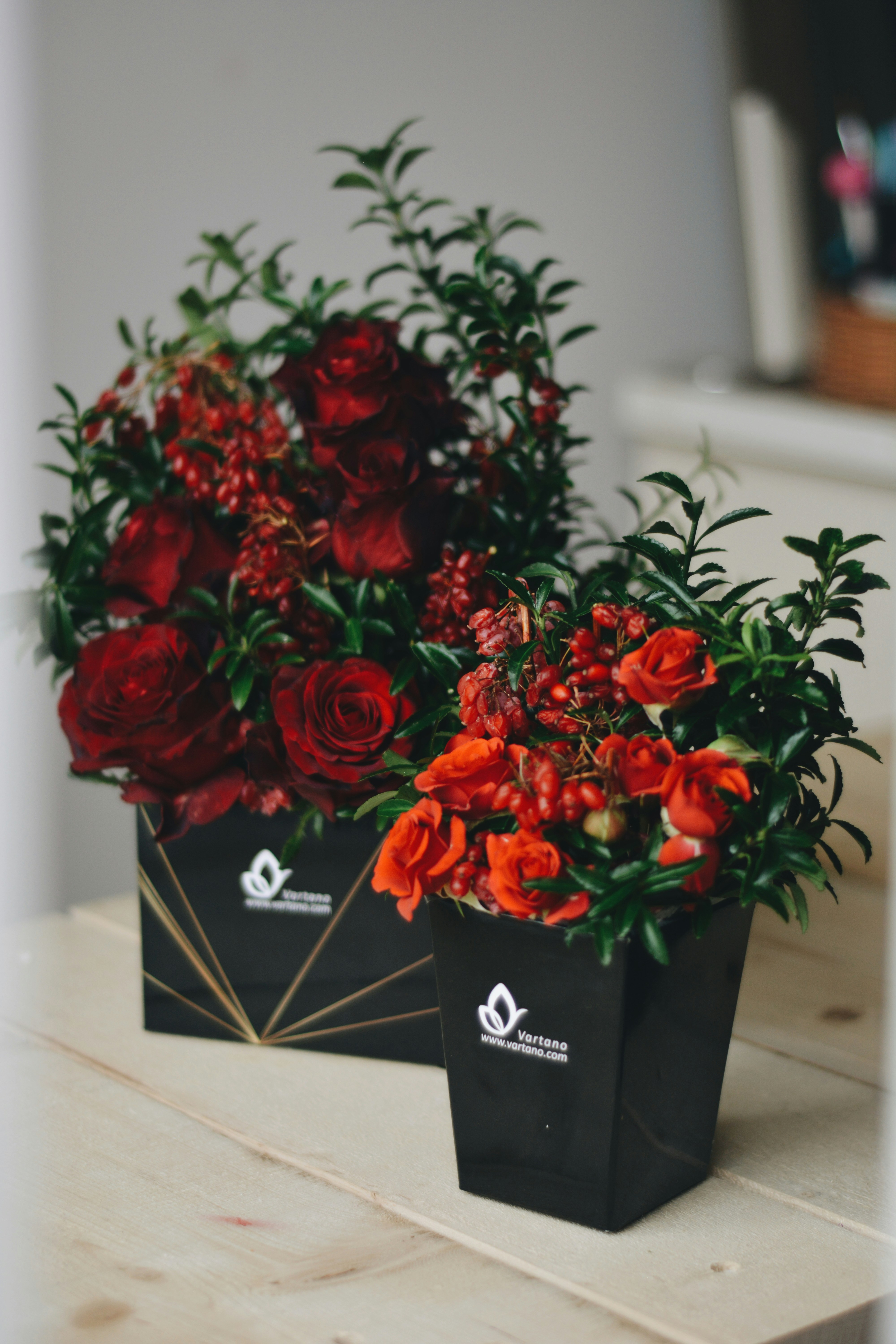 Bouquets in Focus: Crimson Roses and Ember Sprays in Matte Black Vases