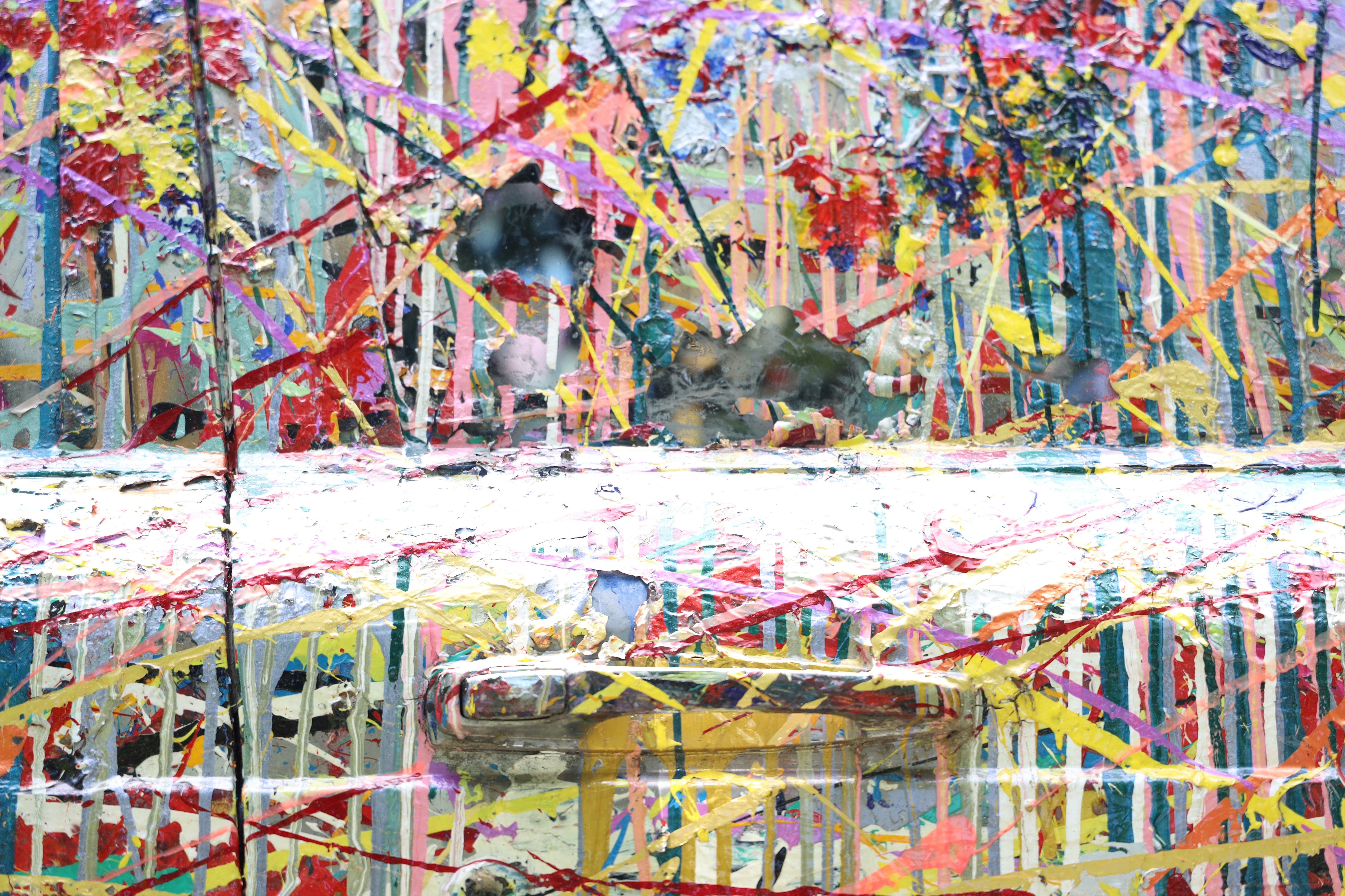 Abstract painting featuring a chaotic interplay of colors and textures, with thick brush strokes creating a sense of movement and energy.