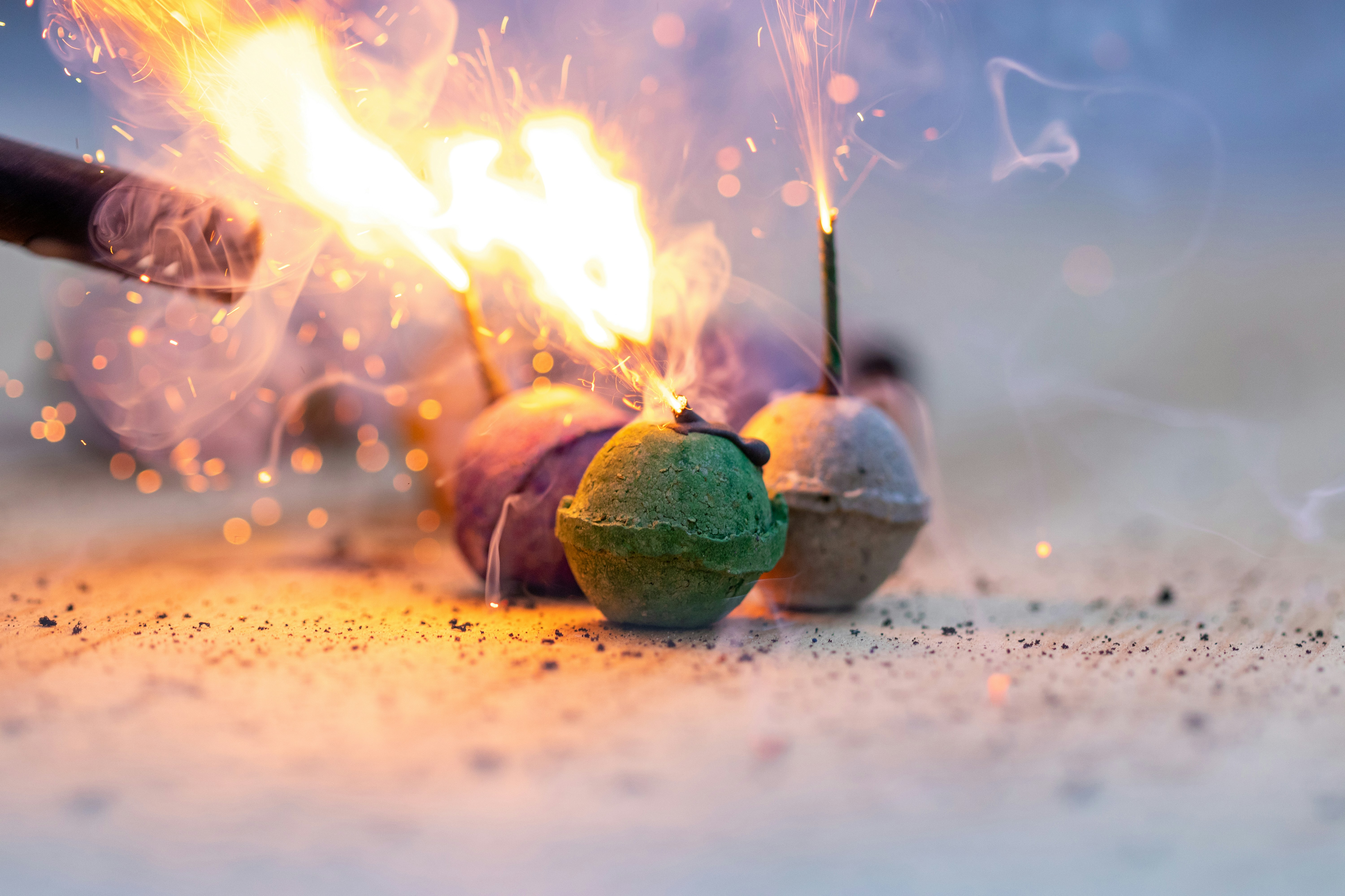 Ground Fireworks: Centered Spark and Smoke Await the Burst