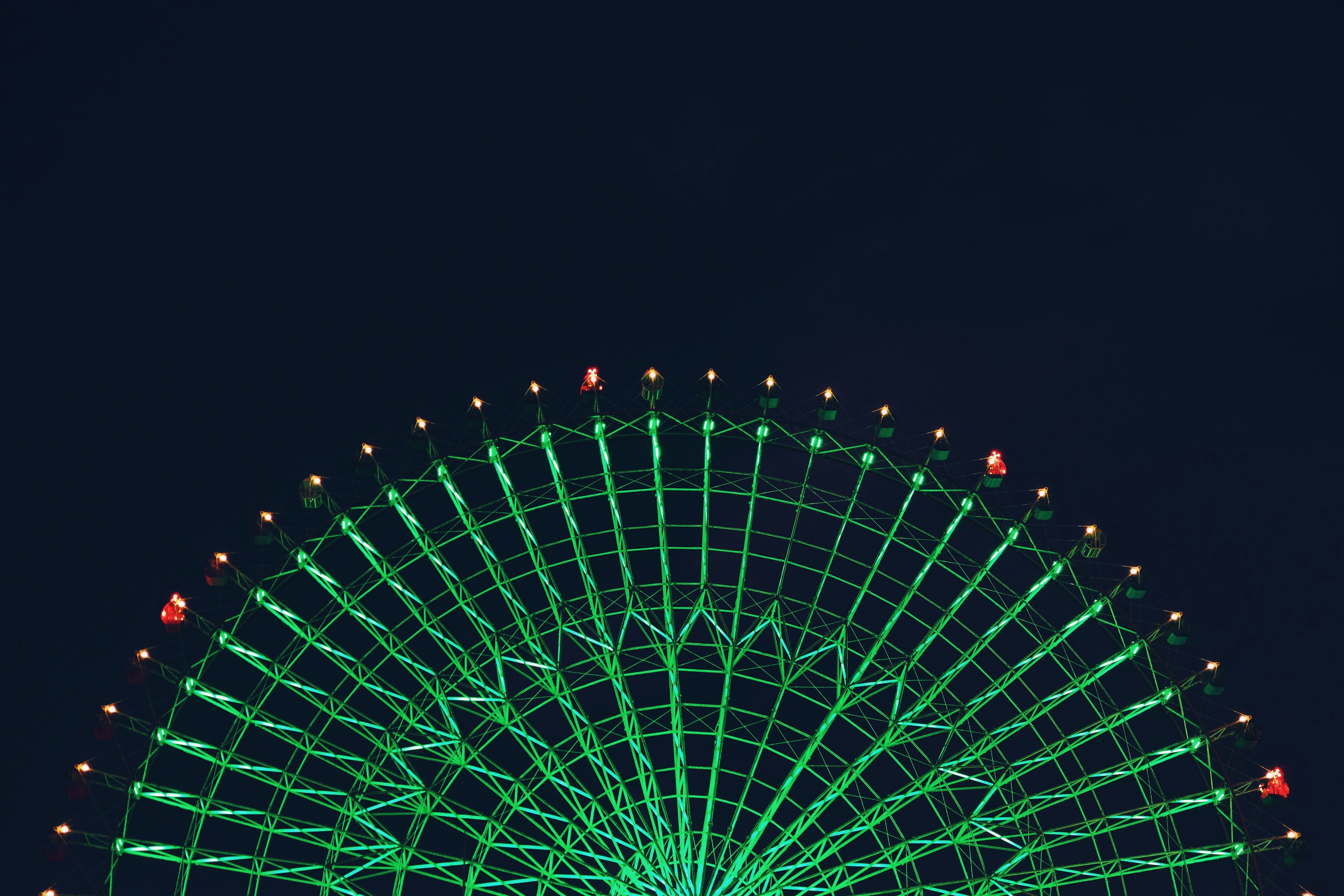 green and white ferris wheel during night time