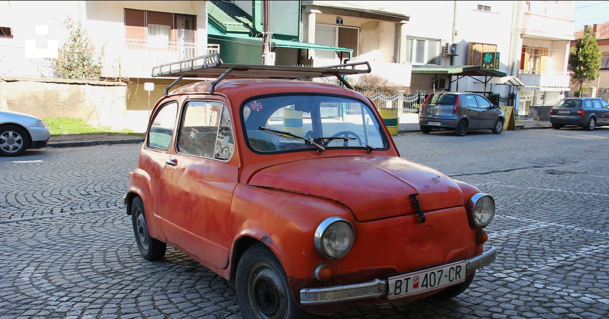 Red Volkswagen Beetle Parked On Street During Daytime Photo Free