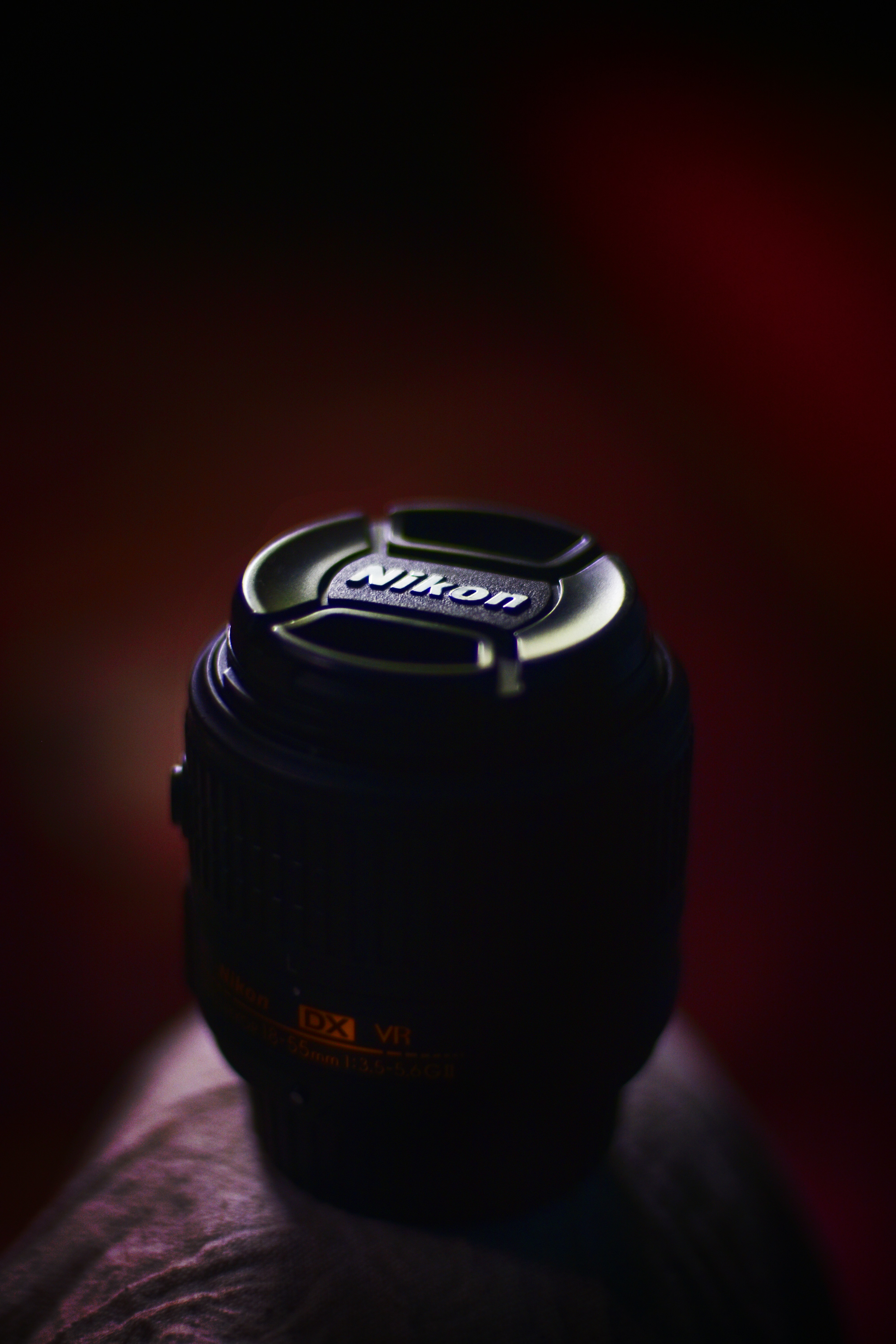 black nikon camera lens cover