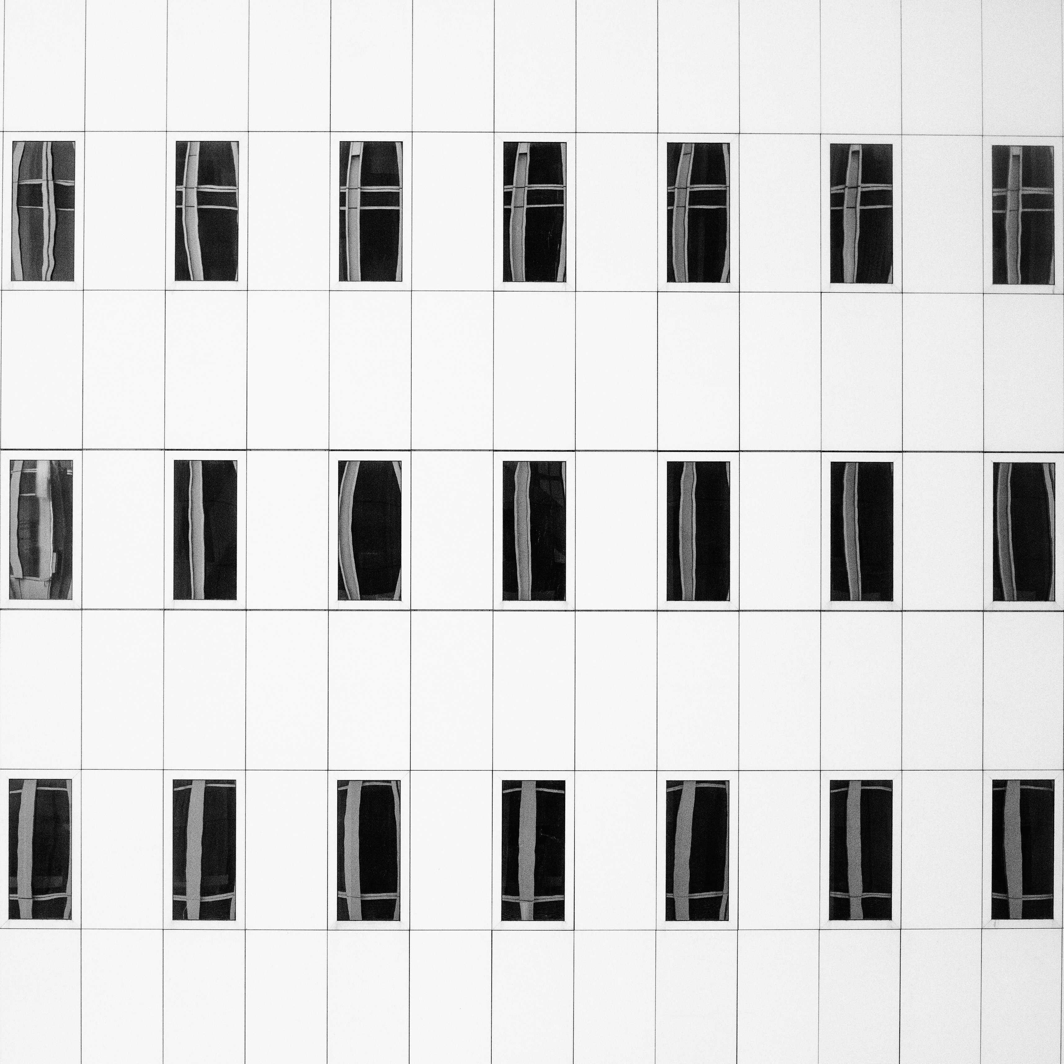 Grayscale Facade Mosaic: Symmetry in a Window Grid