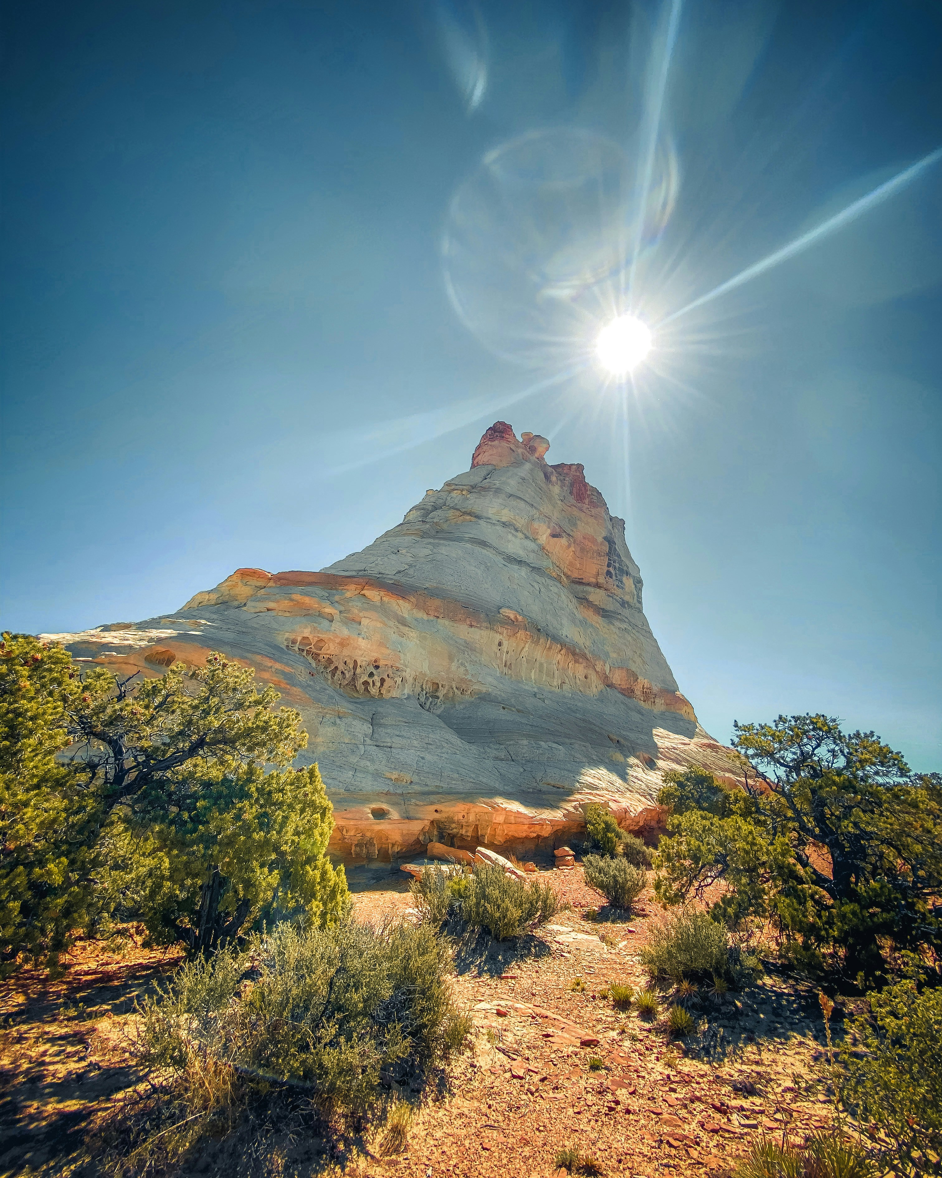Sunlit Spire: A Desert Grayscale Tower Reaching Toward the Sky