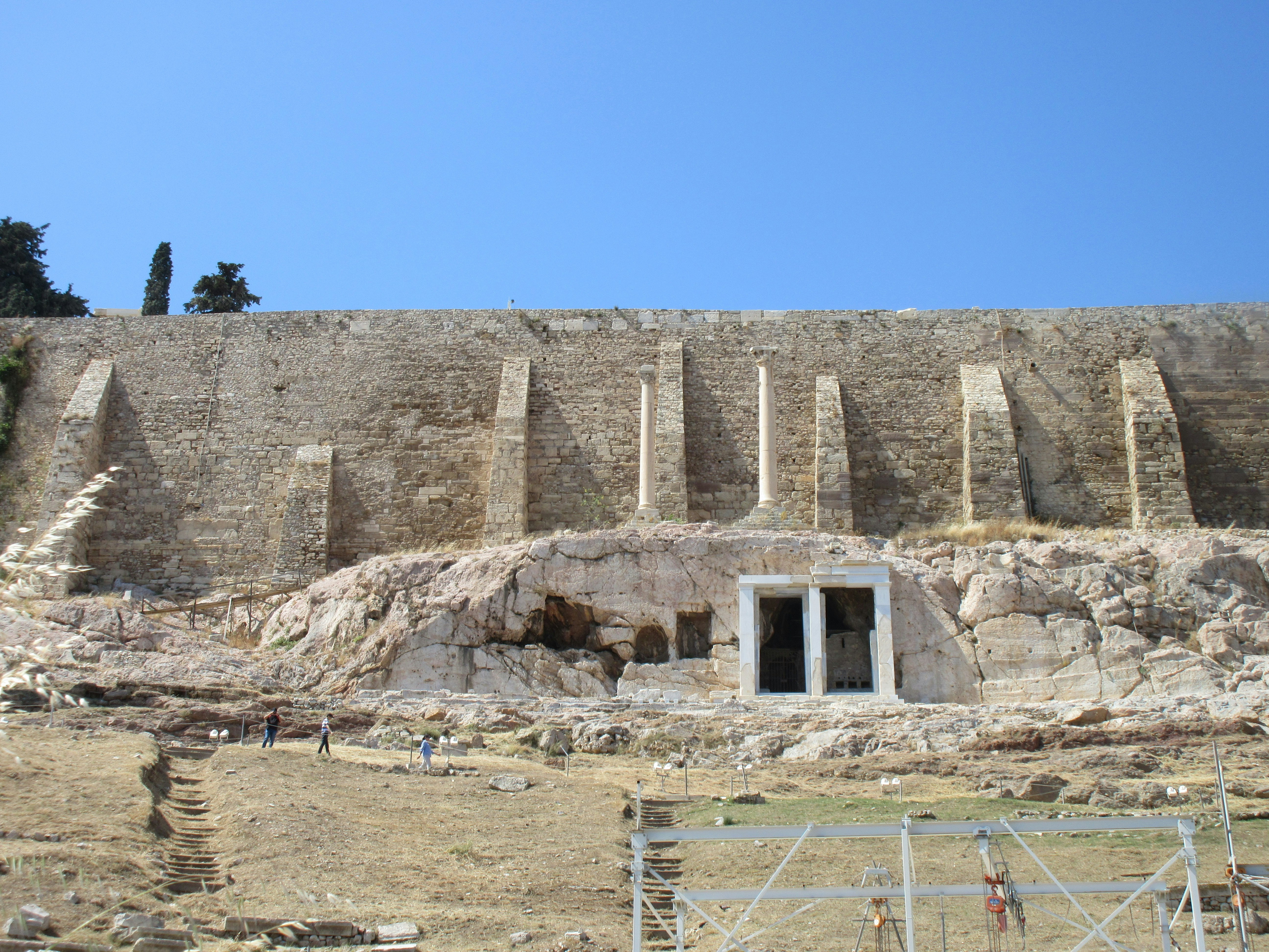 Ancient Stone Facade Emerges from Sunlit Quarry