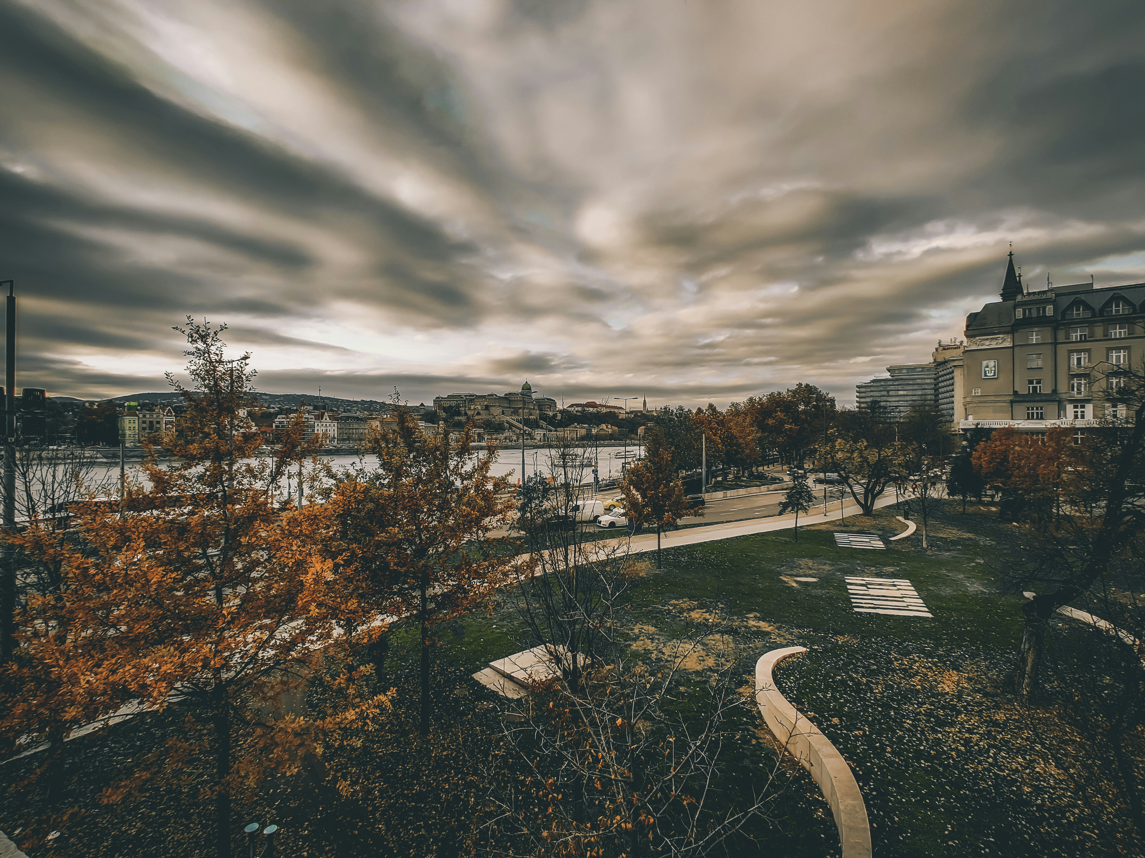 Autumn Riverside Loop Under Dramatic Clouds