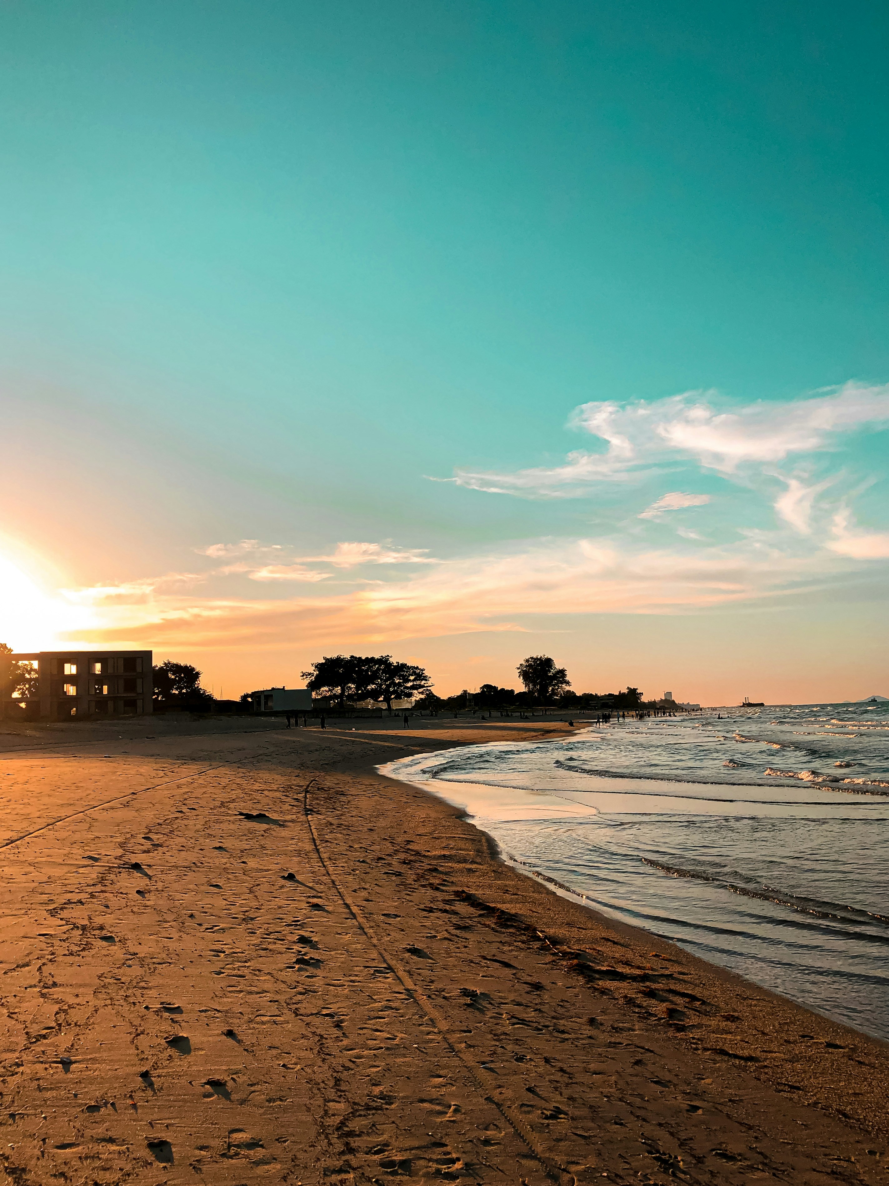 Silhouette of building near beach during sunset photo – Free Pantai ...